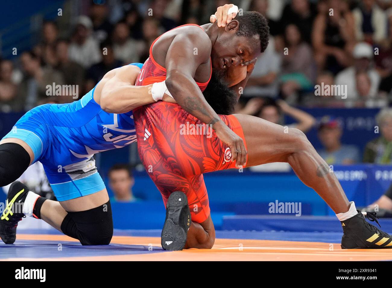 Cuba's Geandry Garzón Caballero and Japan's Daichi Takatani, left ...