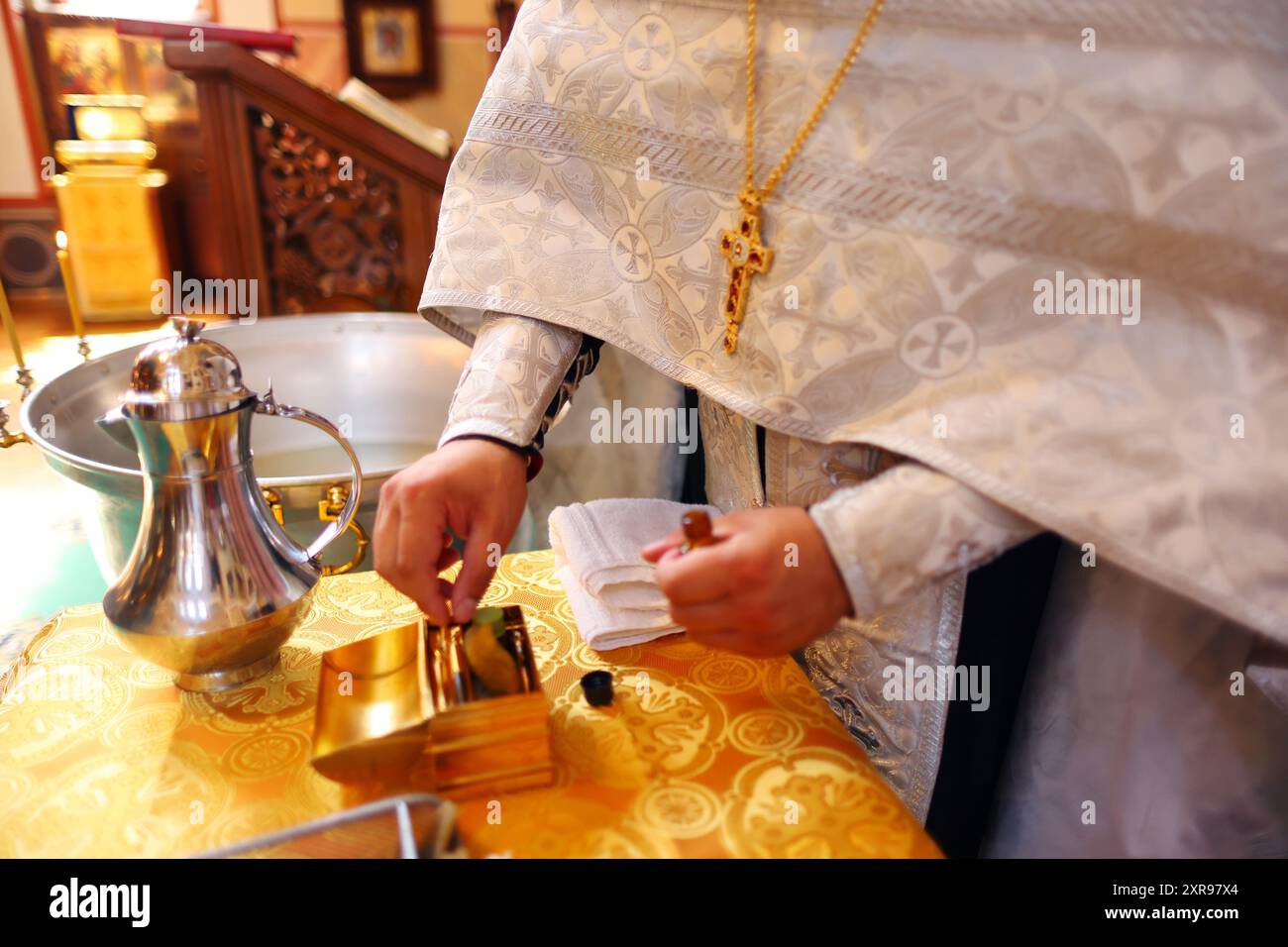 Orthodox priest preparing for the ritual of baptism fragment Stock ...