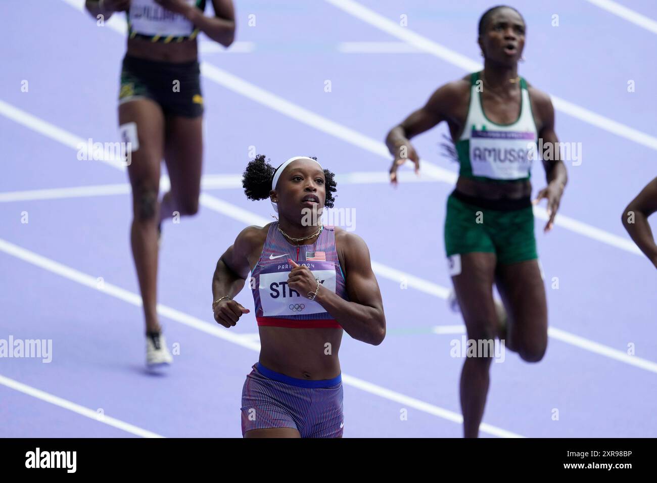 Grace Stark, of the United States, wins a women's 100 meters hurdles ...