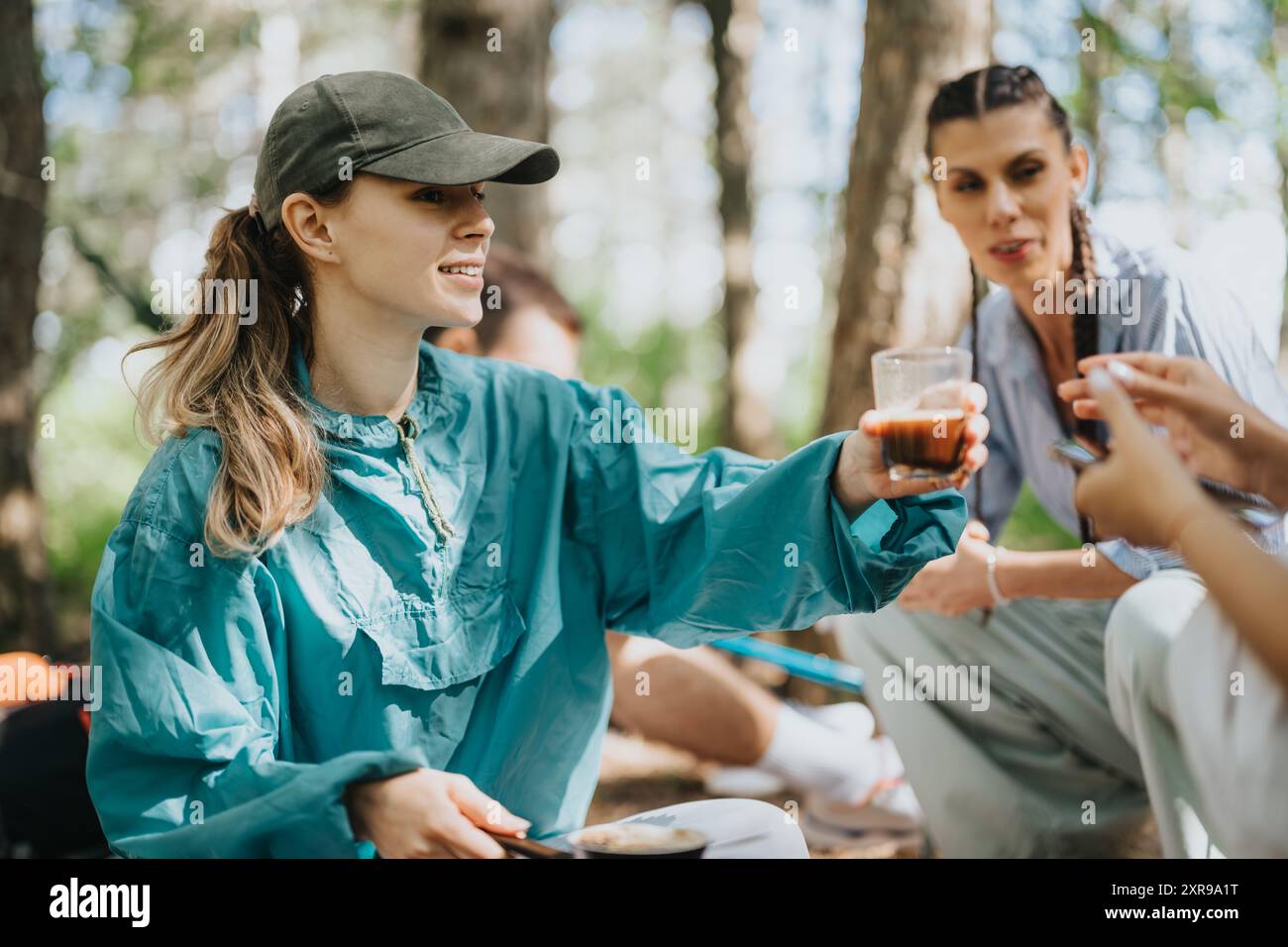 Outdoor friends gathering and enjoying drinks in nature Stock Photo - Alamy