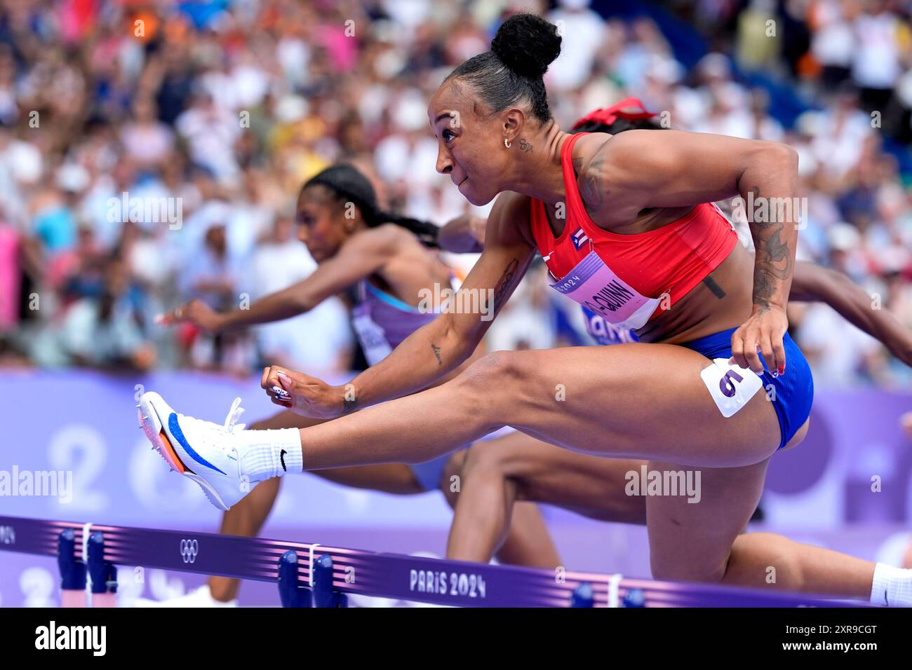 Jasmine Camacho-Quinn, of Puerto Rico, competes in the women's 100 ...