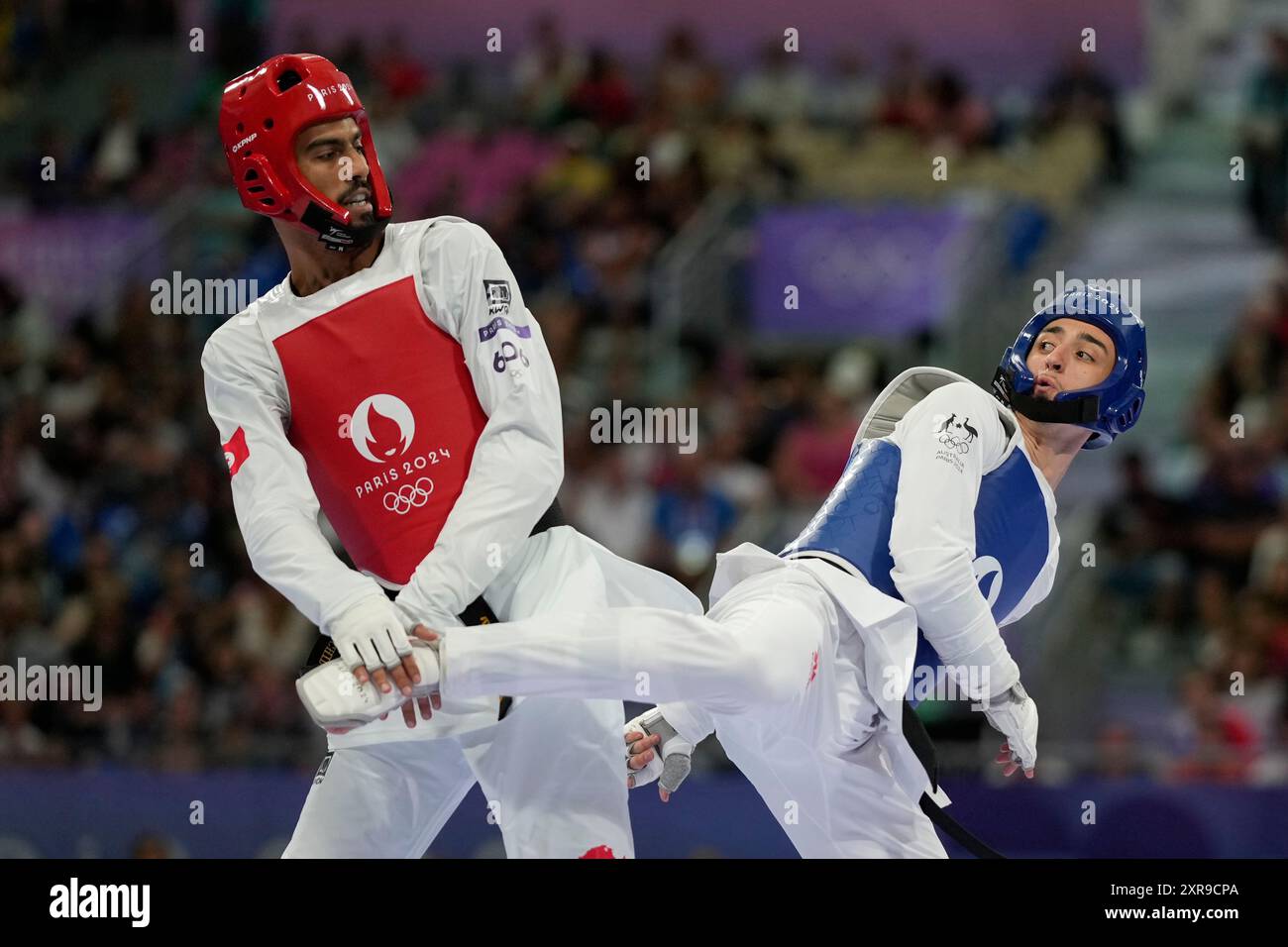 Australia's Leon Sejranovic competes with Tunisia's Firas Katoussi in a ...
