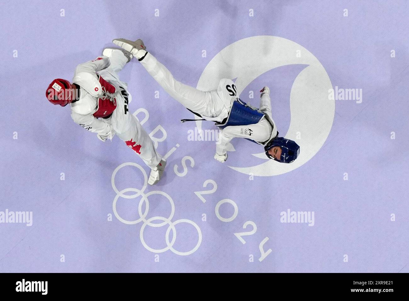Australia's Leon Sejranovic competes with Tunisia's Firas Katoussi in a ...