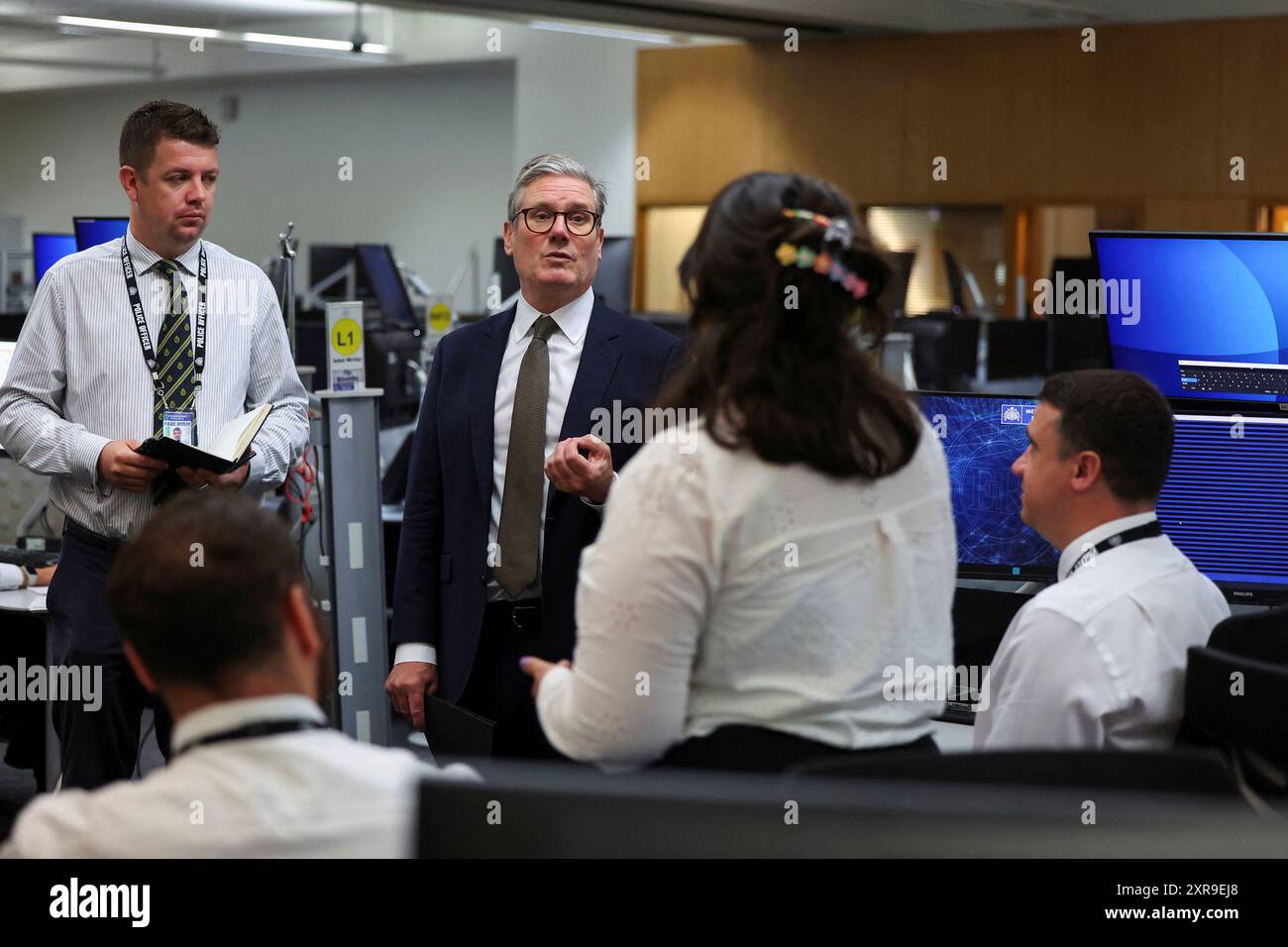 British Prime Minister Keir Starmer speaks with police staff at the ...