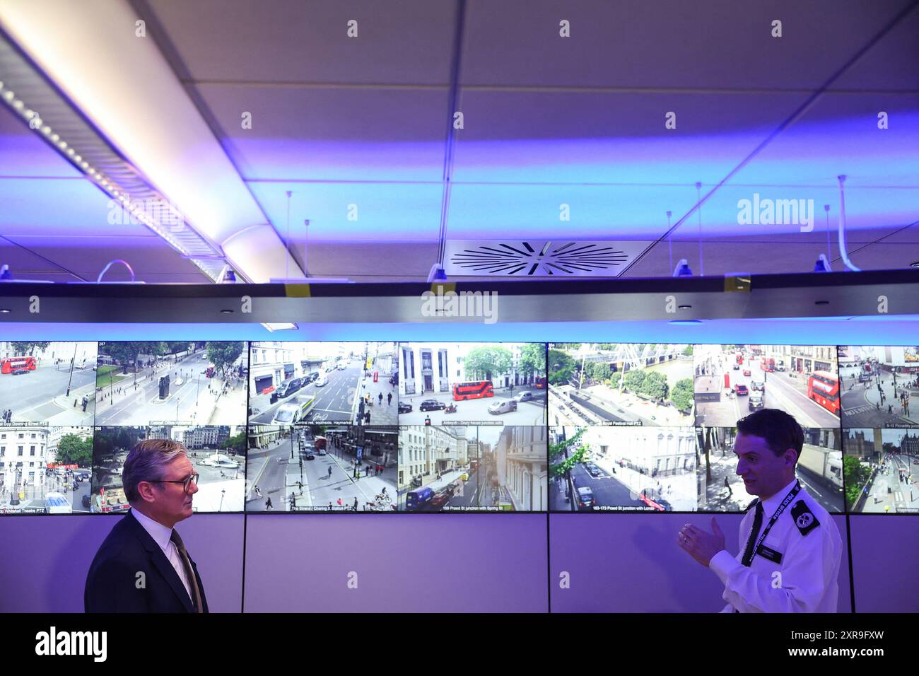 Prime Minister Keir Starmer speaks with Commander Ben Russell beside ...