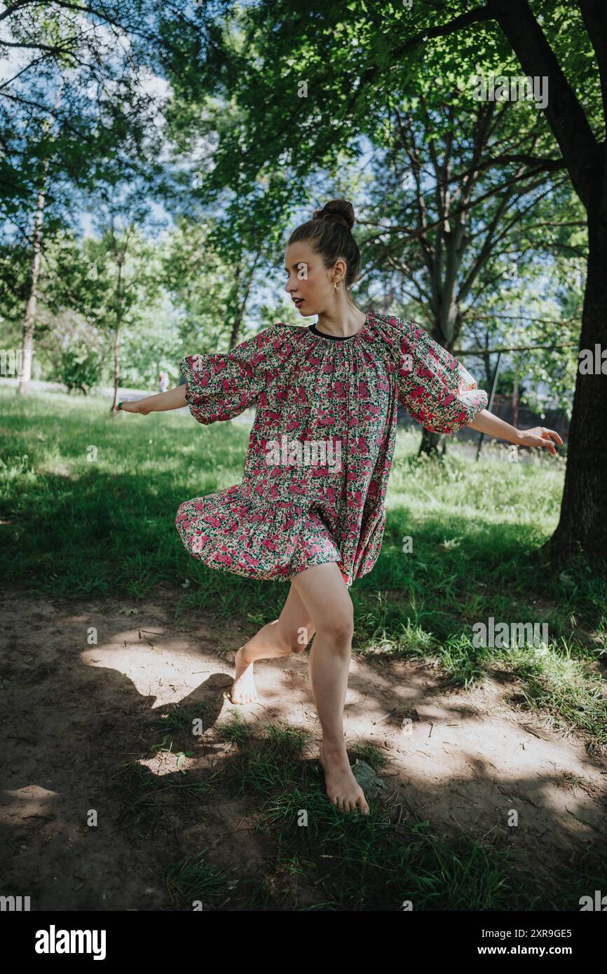 Girl performing modern dance in nature, expressing freedom and joy in ...