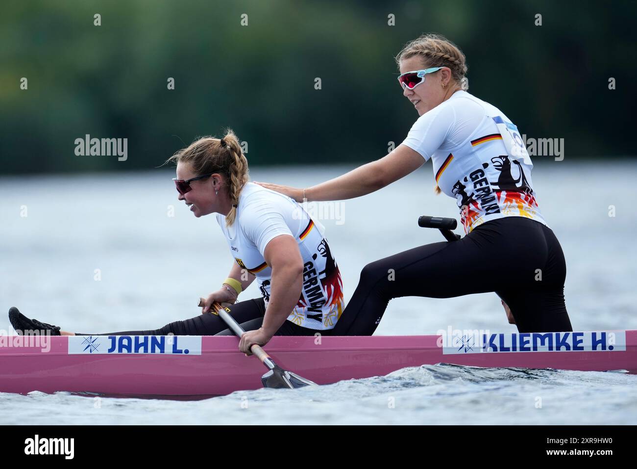 Germany's Lisa Jahn and Hedi Moana Kliemke react in the finish area of ...