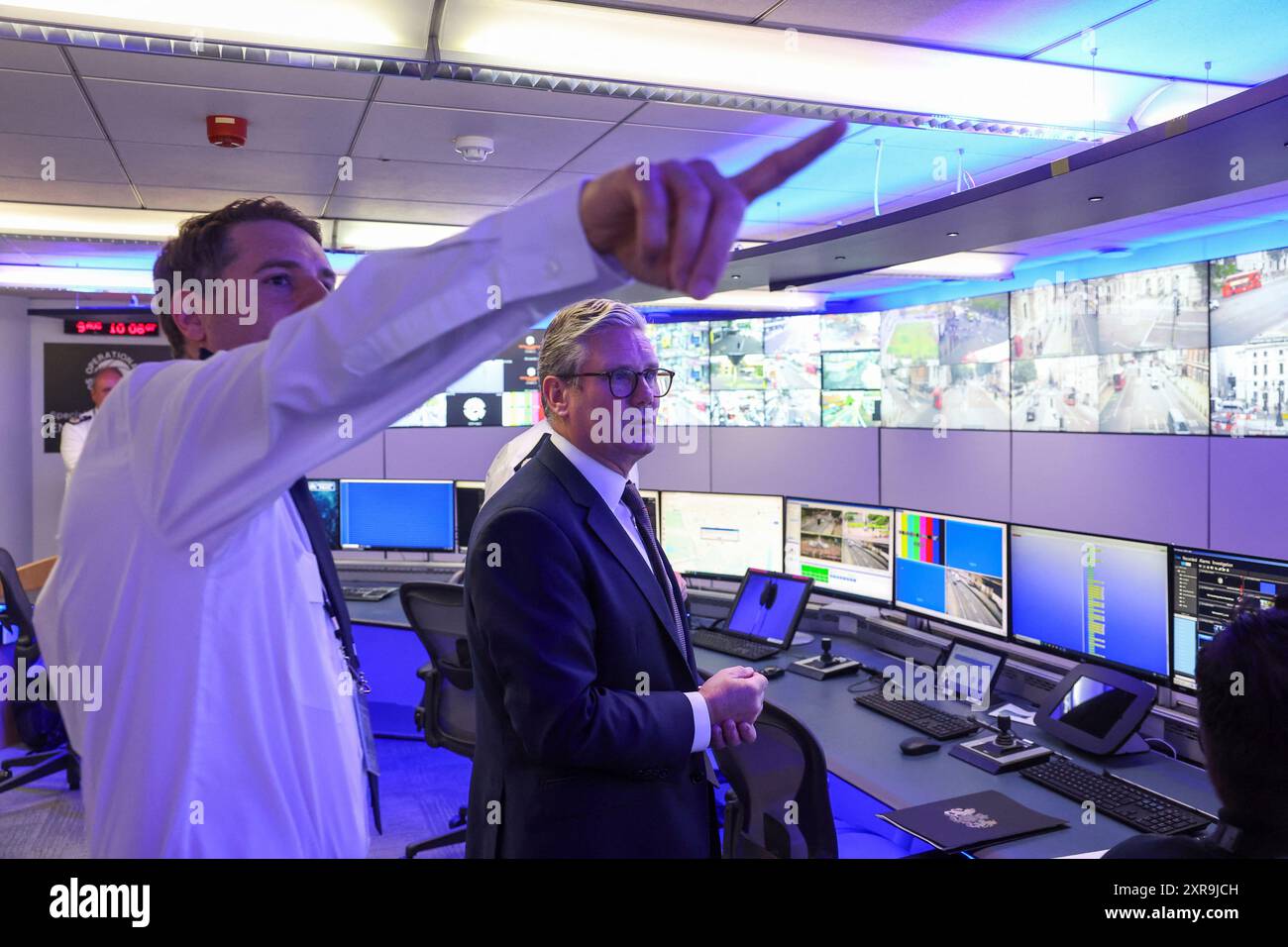 Prime Minister Keir Starmer views CCTV screens with Commander Ben ...