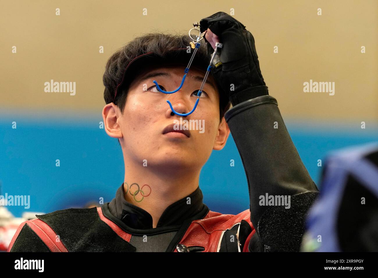 South Korea's Choe Daehan prepares to compete in the 10m air rifle men ...