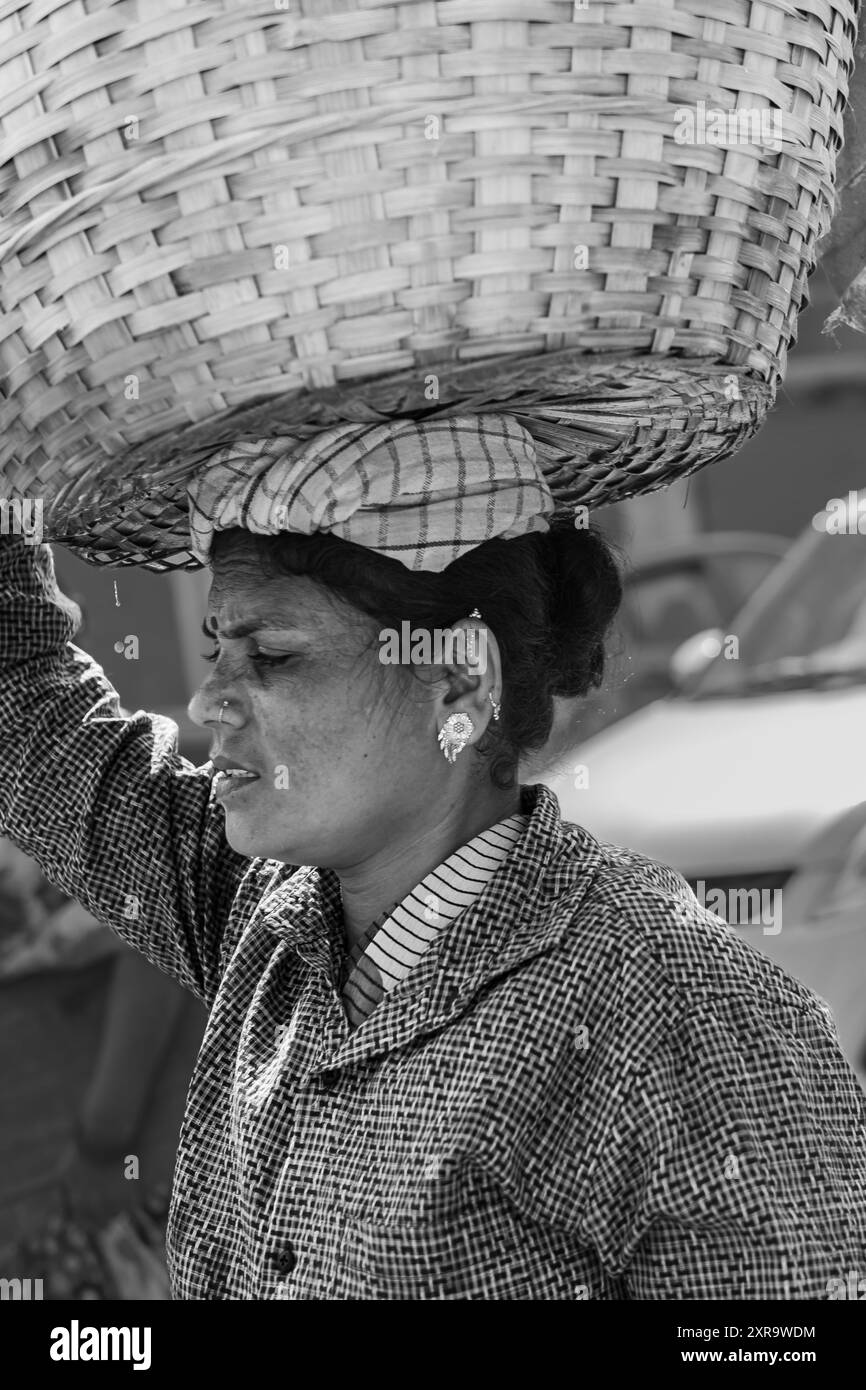 Woman carrying a basket on her head Goa India. Indian woman with big ...