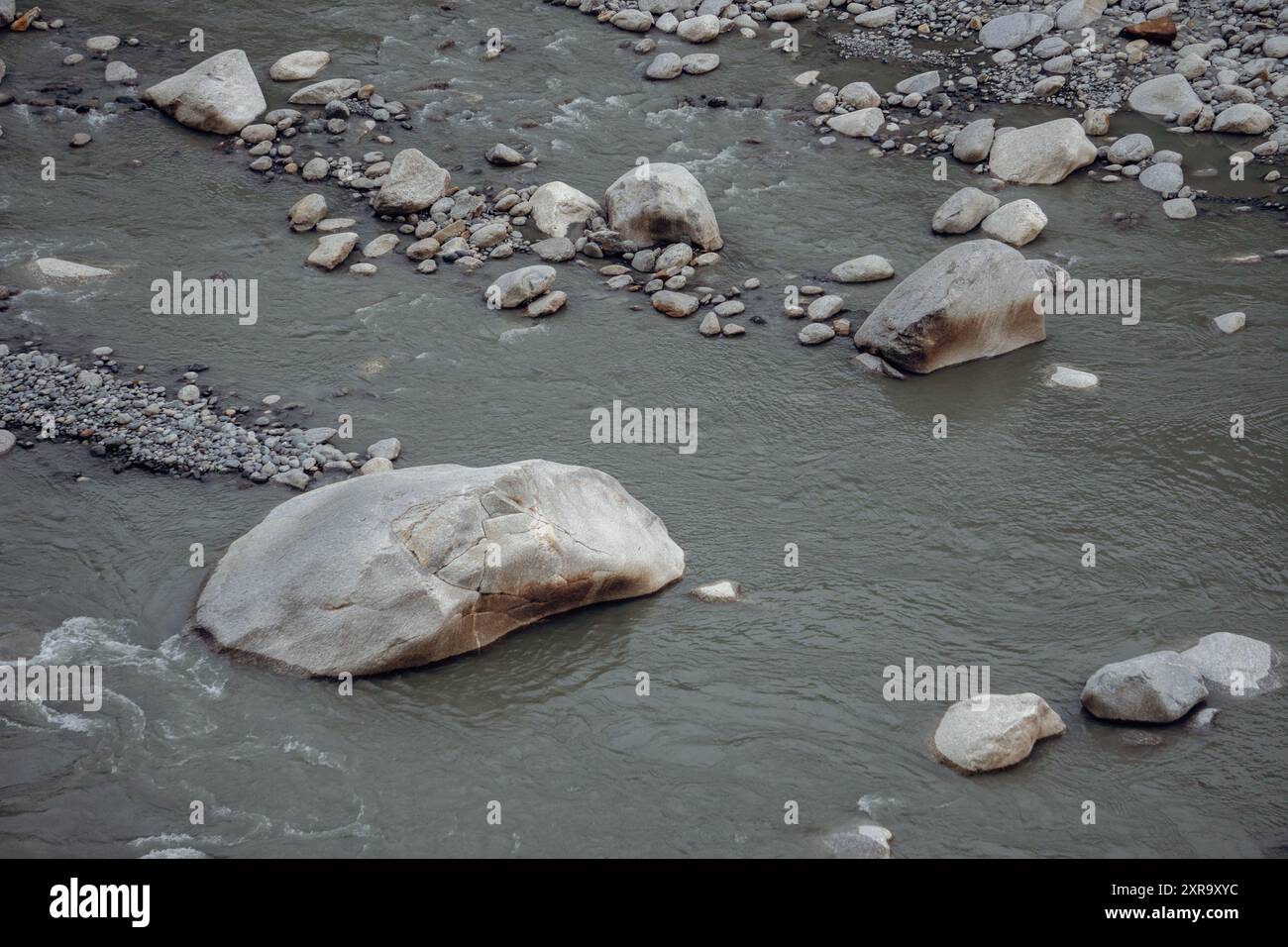 Big stones and rubble washed into the river bed during the monsoon ...