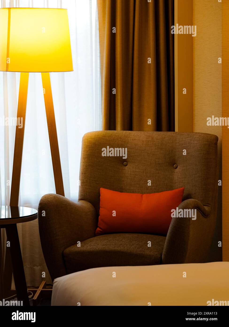 Reading chair with a standing lamp Stock Photo - Alamy
