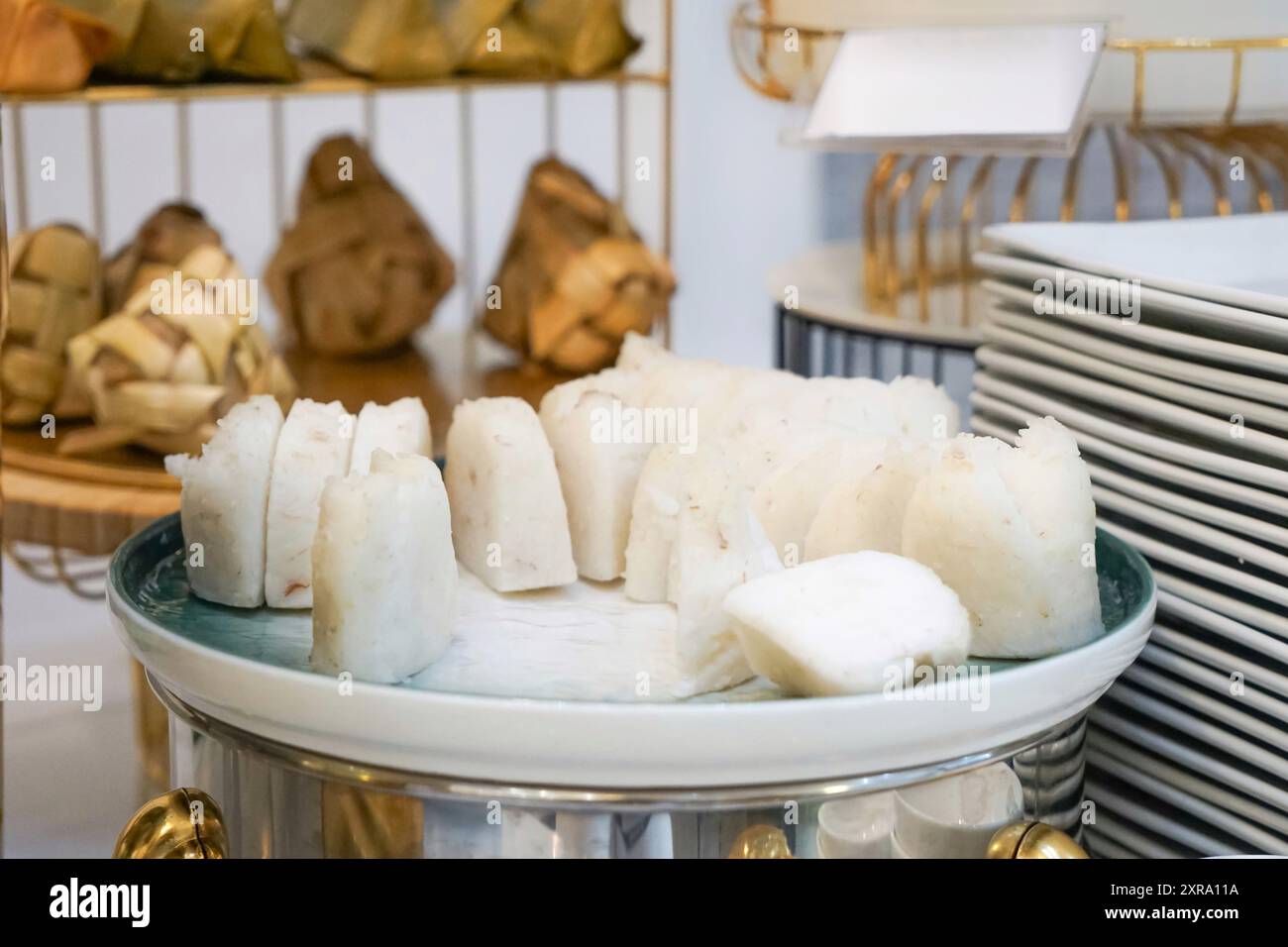 Nasi impit in a white plate Stock Photo - Alamy