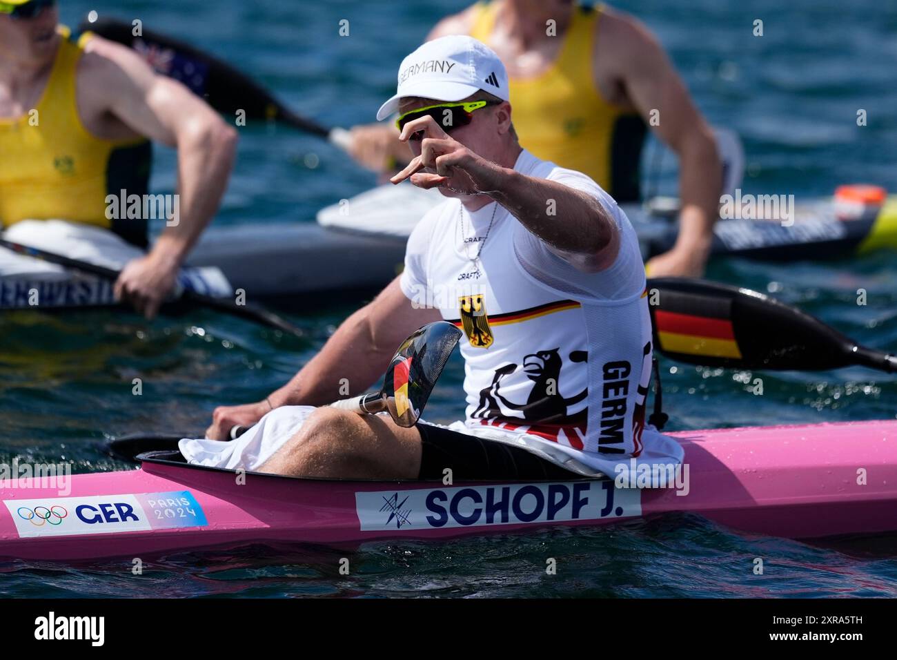 Germany's Jacob Schopf gestures after winning gold with Max Lemke in ...