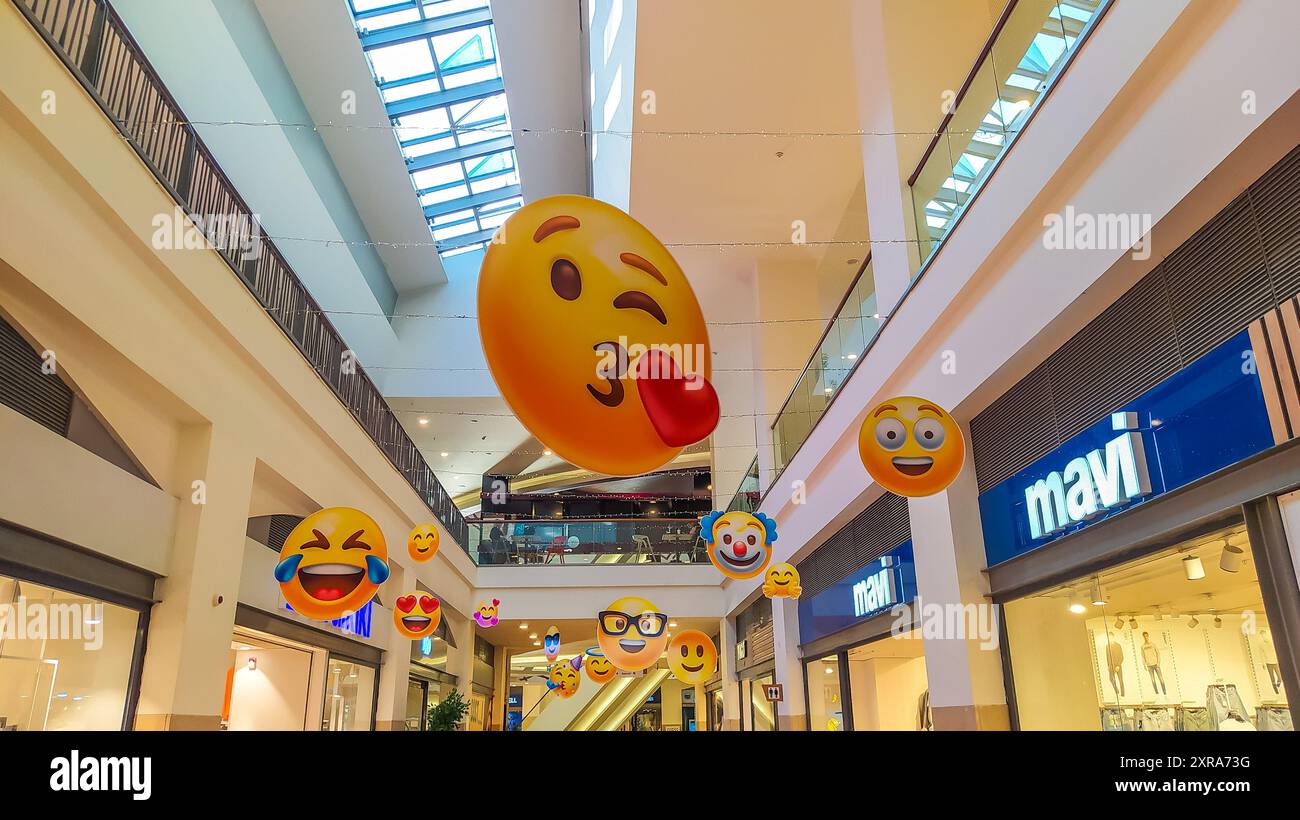 Colorful emoji decorations in a shopping mall, symbolizing digital ...