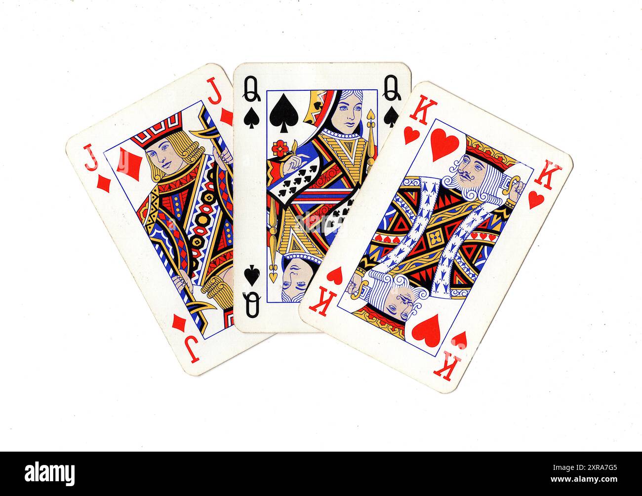 Vintage playing cards showing a run of jack, queen, king on a white ...