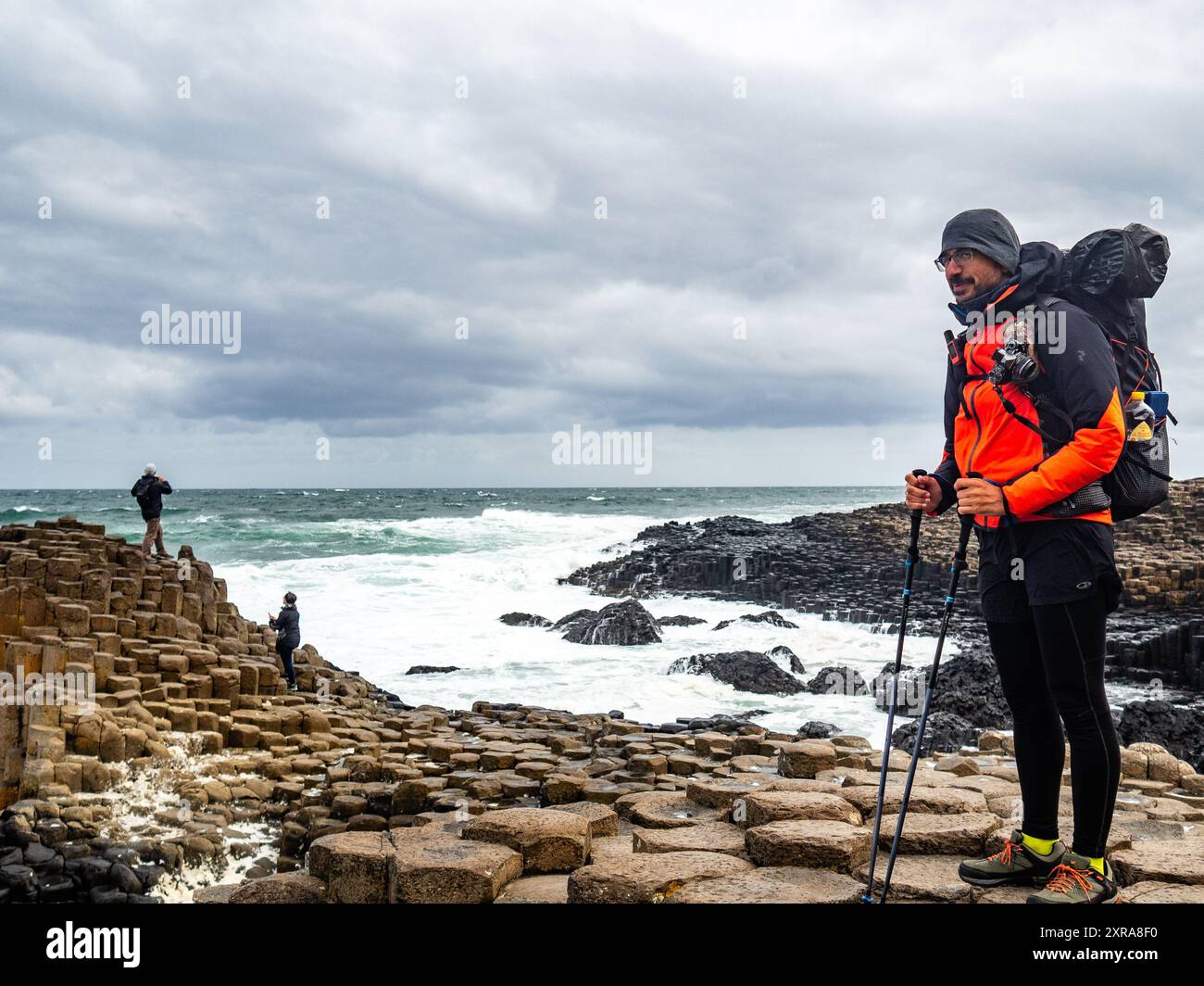 A hiker is observing the hexagonal stones. The Giant’s Causeway and ...