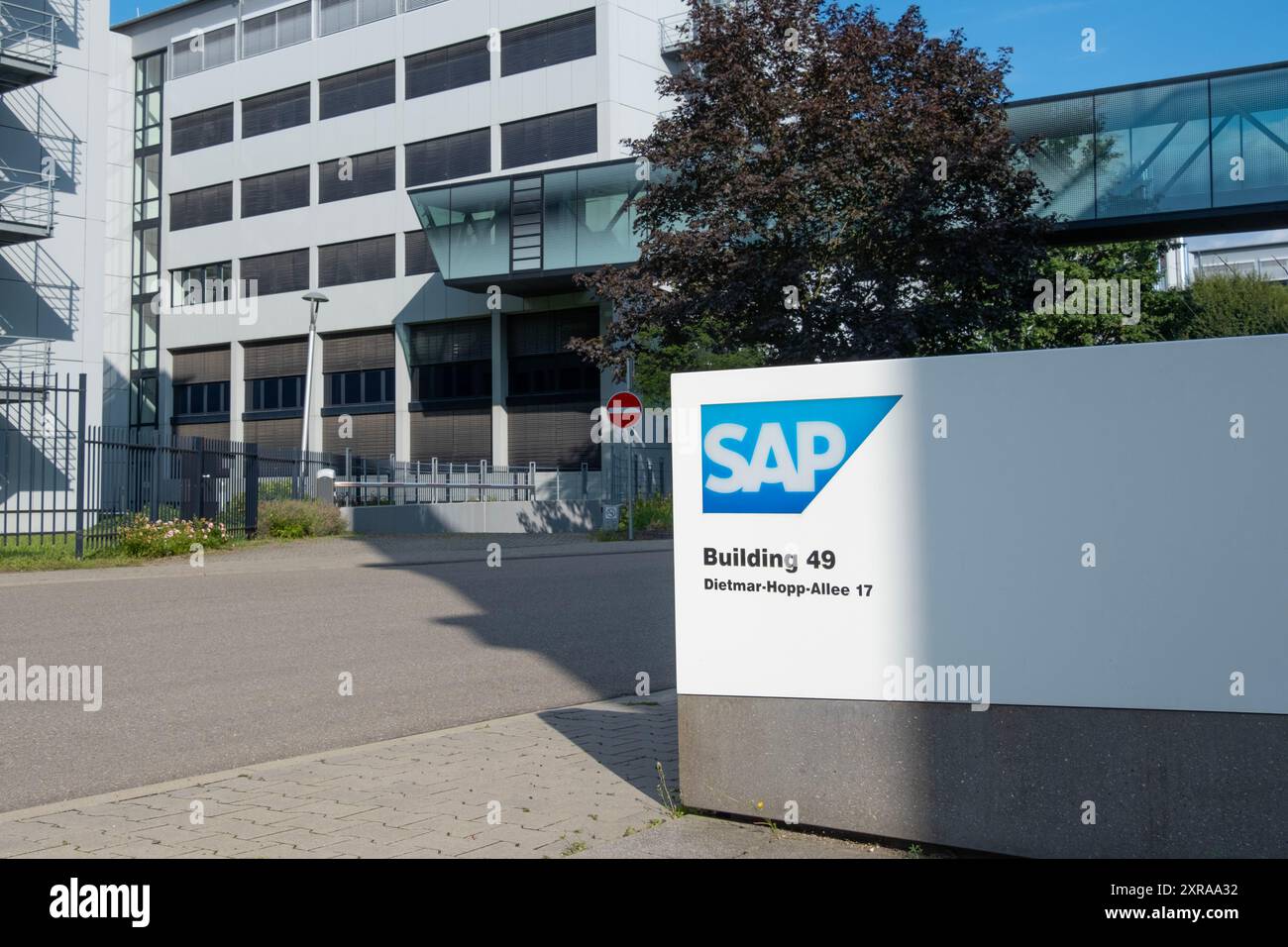 SAP SE logo prominently displayed on modern corporate headquarters facade, SAP corporate campus ...