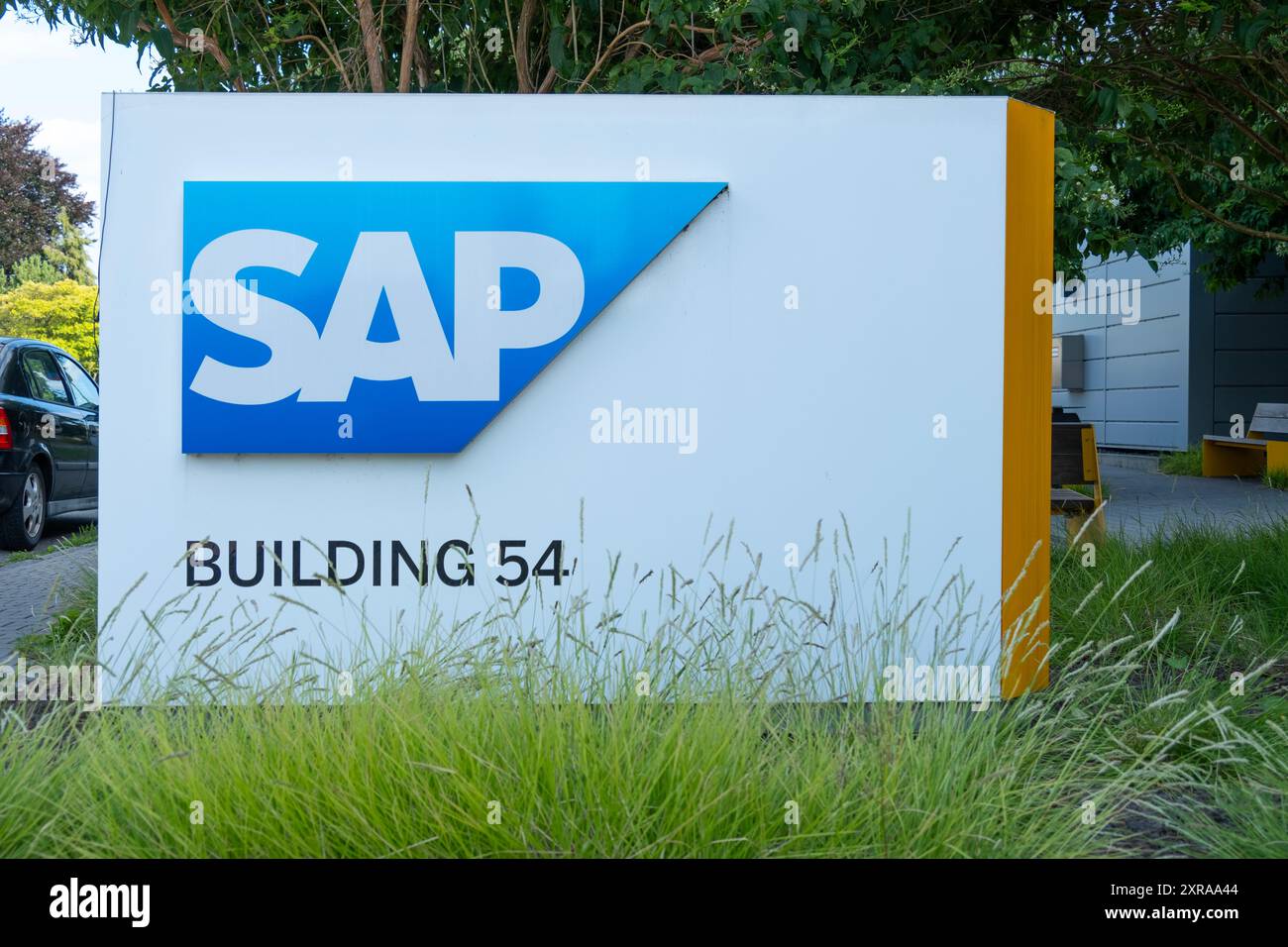 SAP SE logo prominently displayed on modern corporate headquarters facade, SAP corporate campus ...