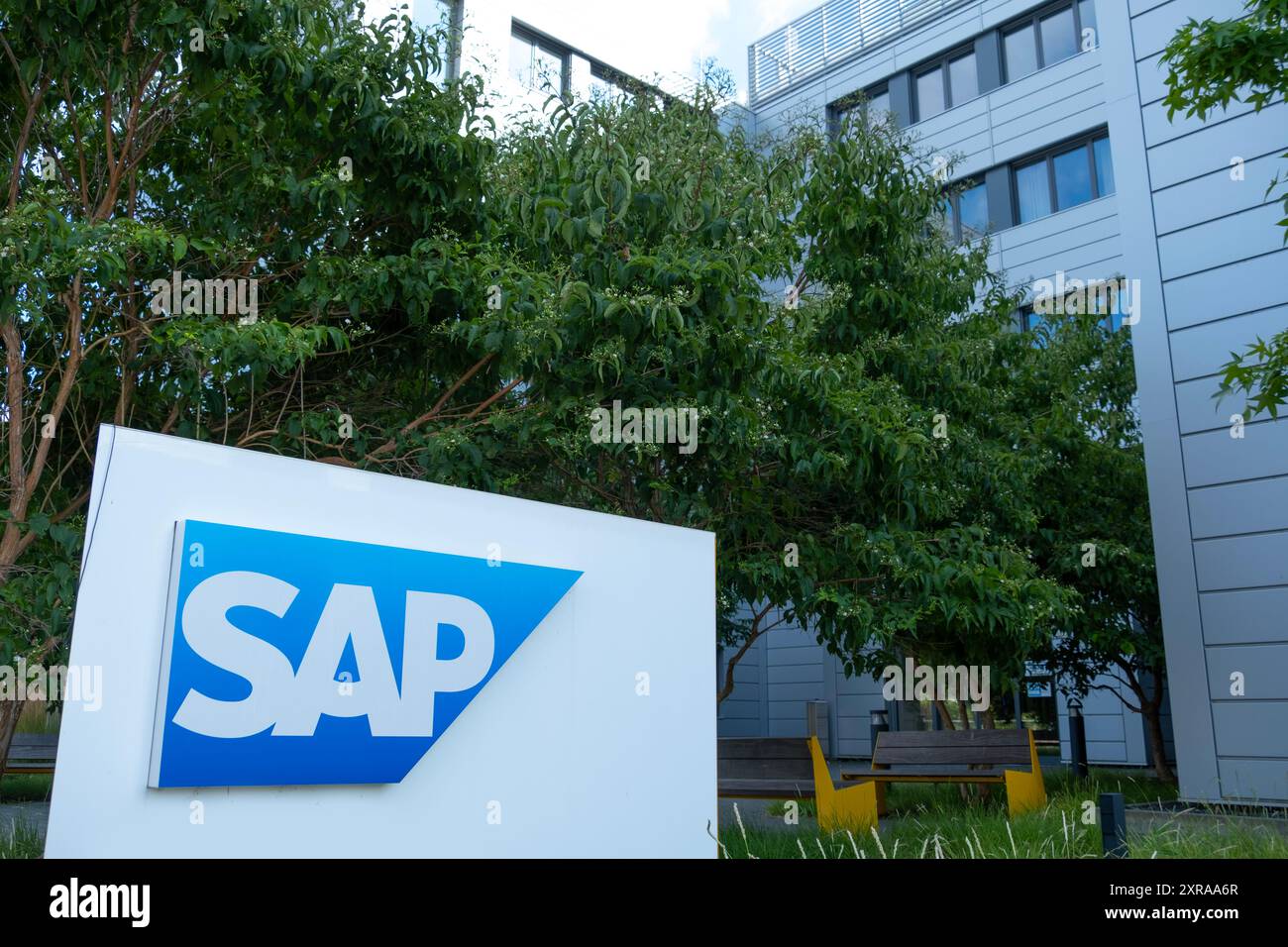 SAP SE logo prominently displayed on modern corporate headquarters facade, SAP corporate campus ...