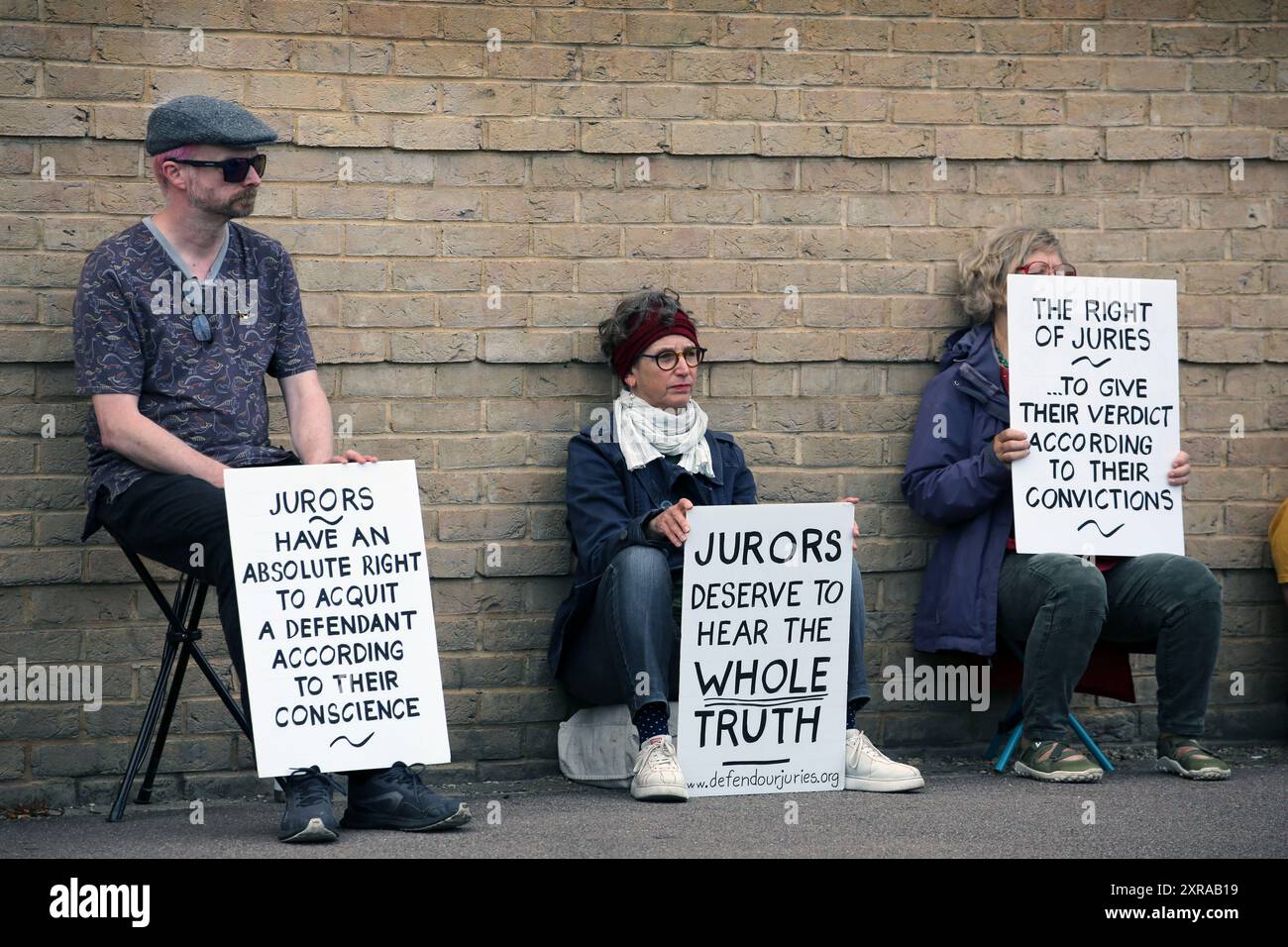 Cambridge, England, UK. 9th Aug, 2024. A group of protesters sit ...