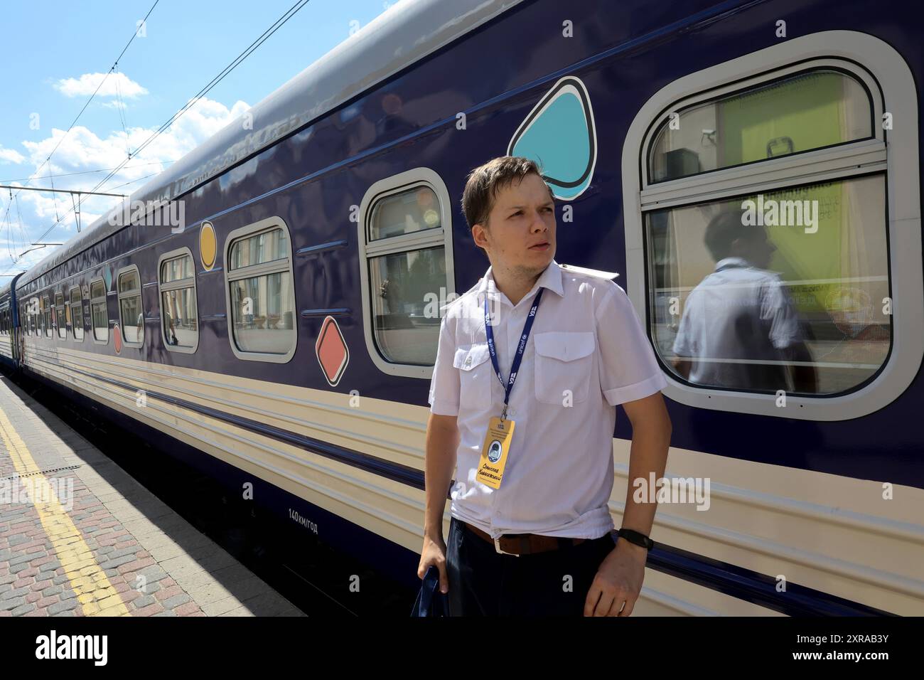 Non Exclusive: KHARKIV, UKRAINE - AUGUST 8, 2024 - A train attendant ...