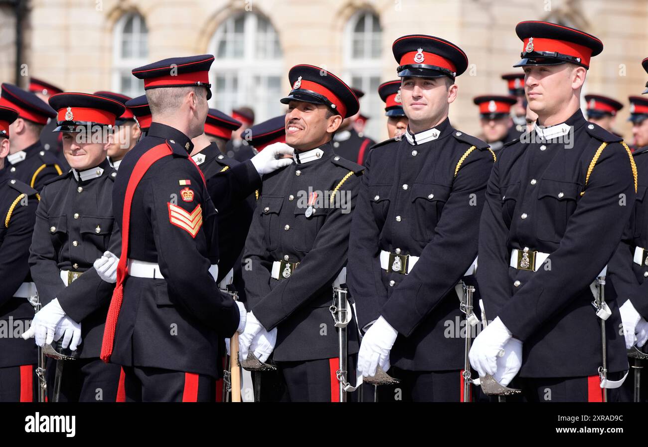 An Officer Cadet has his uniform checked ahead of the Sovereign's ...