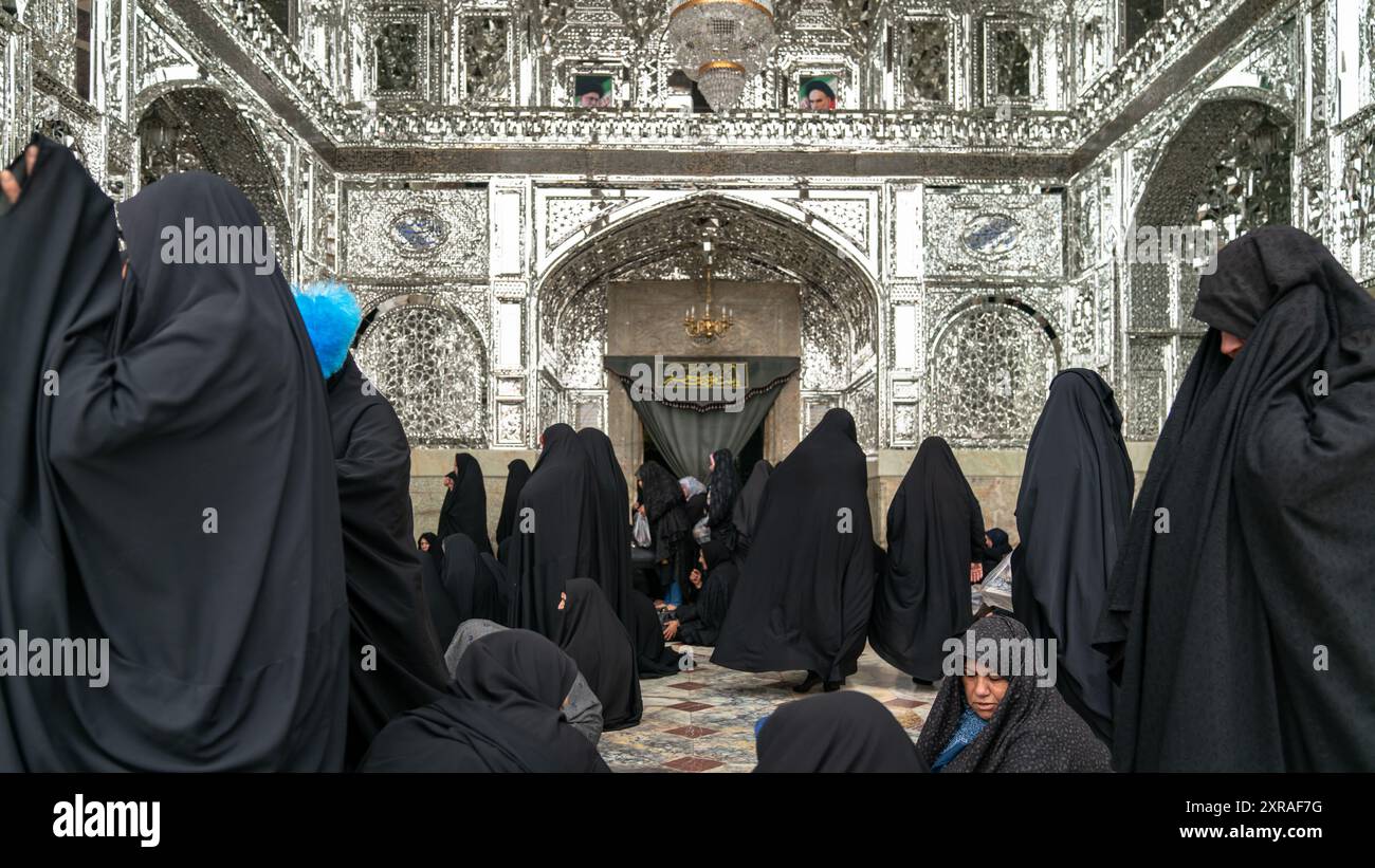 Shrine of Fatima Masumeh, Qom, Iran - 28 April 2019: Iranian women praying inside Shrine of ...