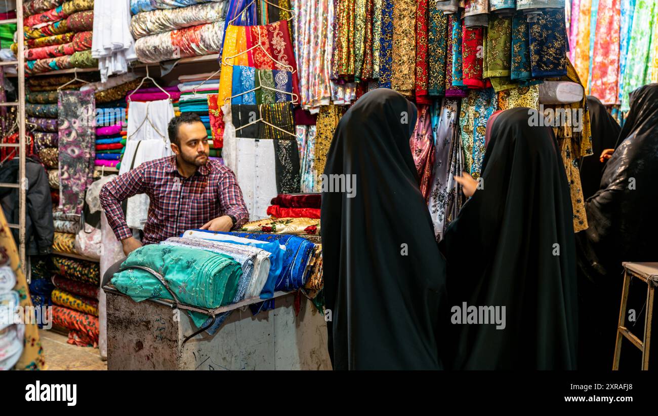 Isfahan, Iran - 1 May 2019: Local Iranian woman shopping at a textile ...