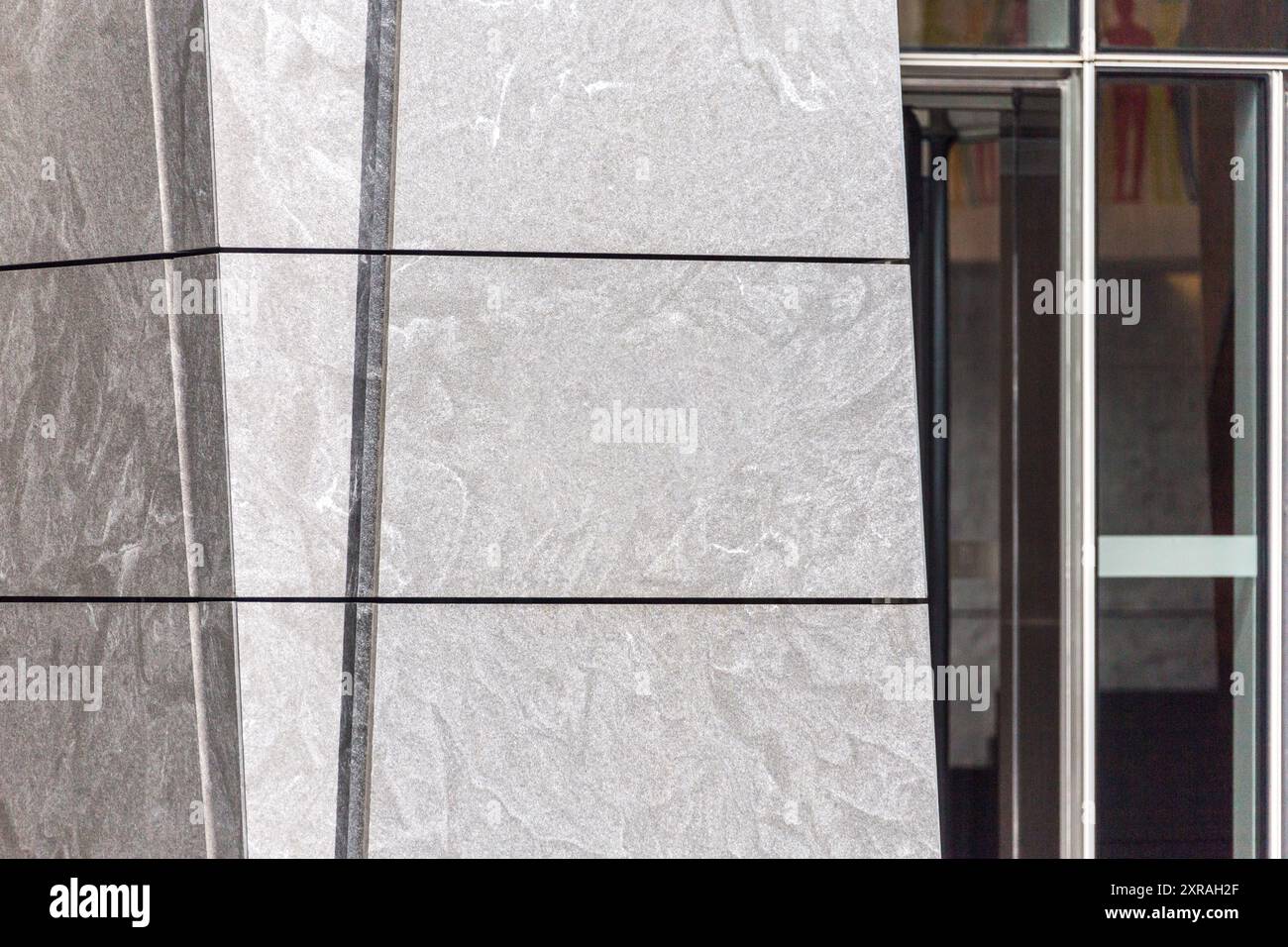 Concrete facade of an office building entrance. Empty space for logo or ...