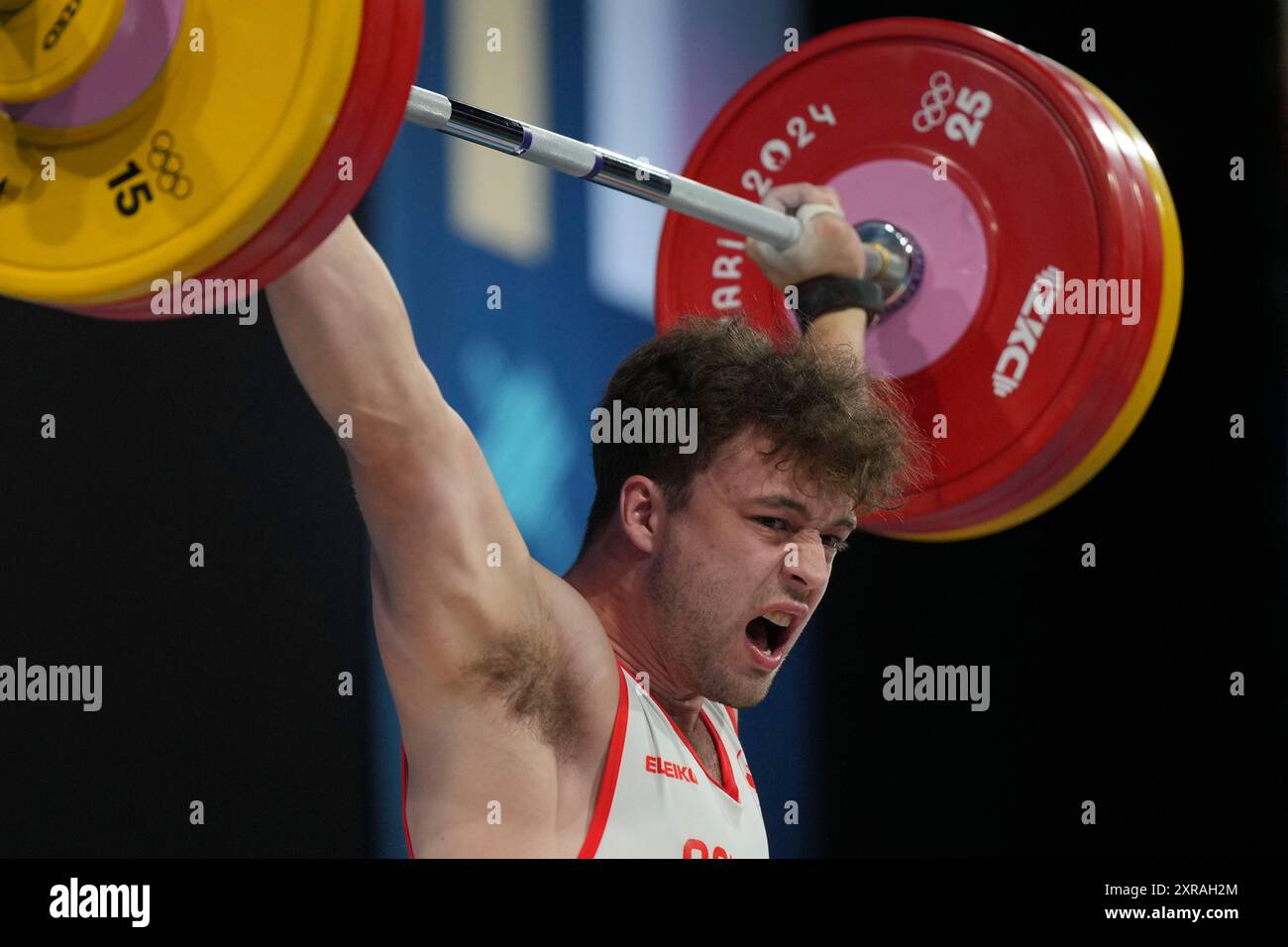 Boady Santavy of Canada competes during the men's 89kg weightlifting ...