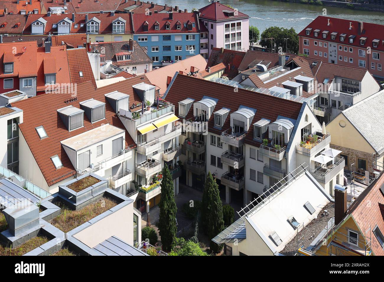 View at the roofs with dormers of multi-storey residential homes with ...