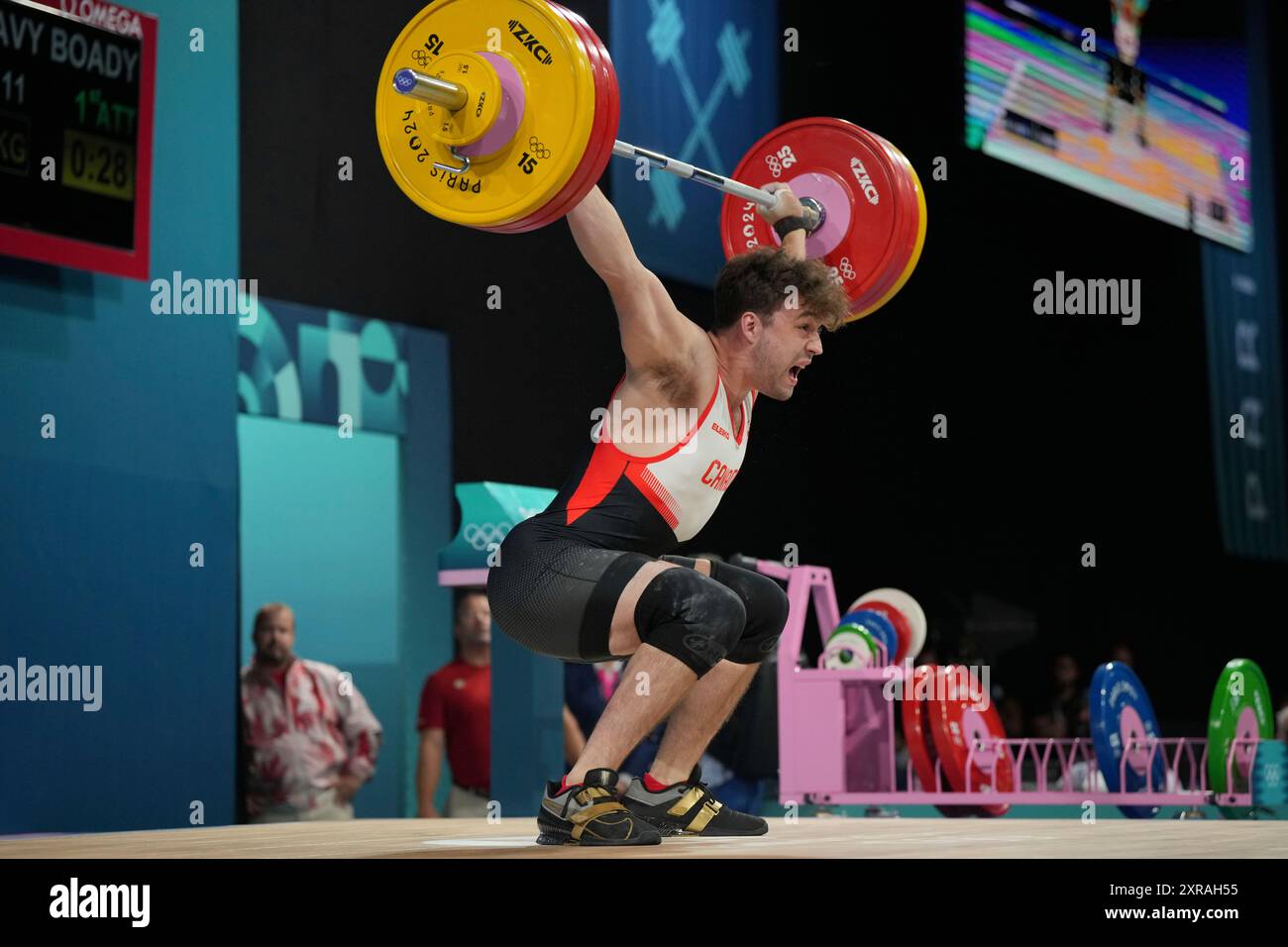 Boady Santavy of Canada competes during the men's 89kg weightlifting ...
