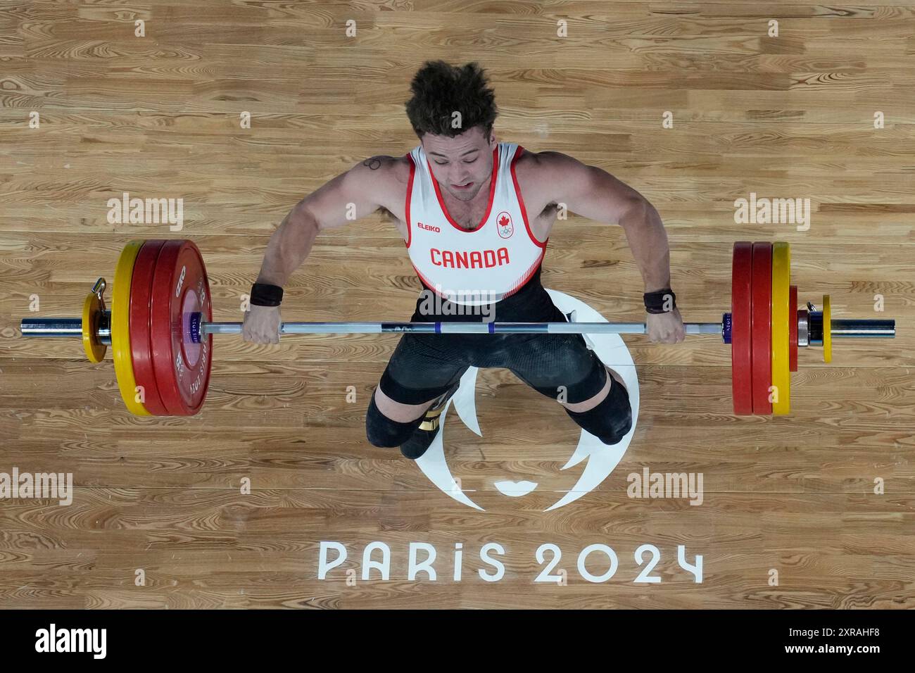 Boady Santavy of Canada competes during the men's 89kg weightlifting ...