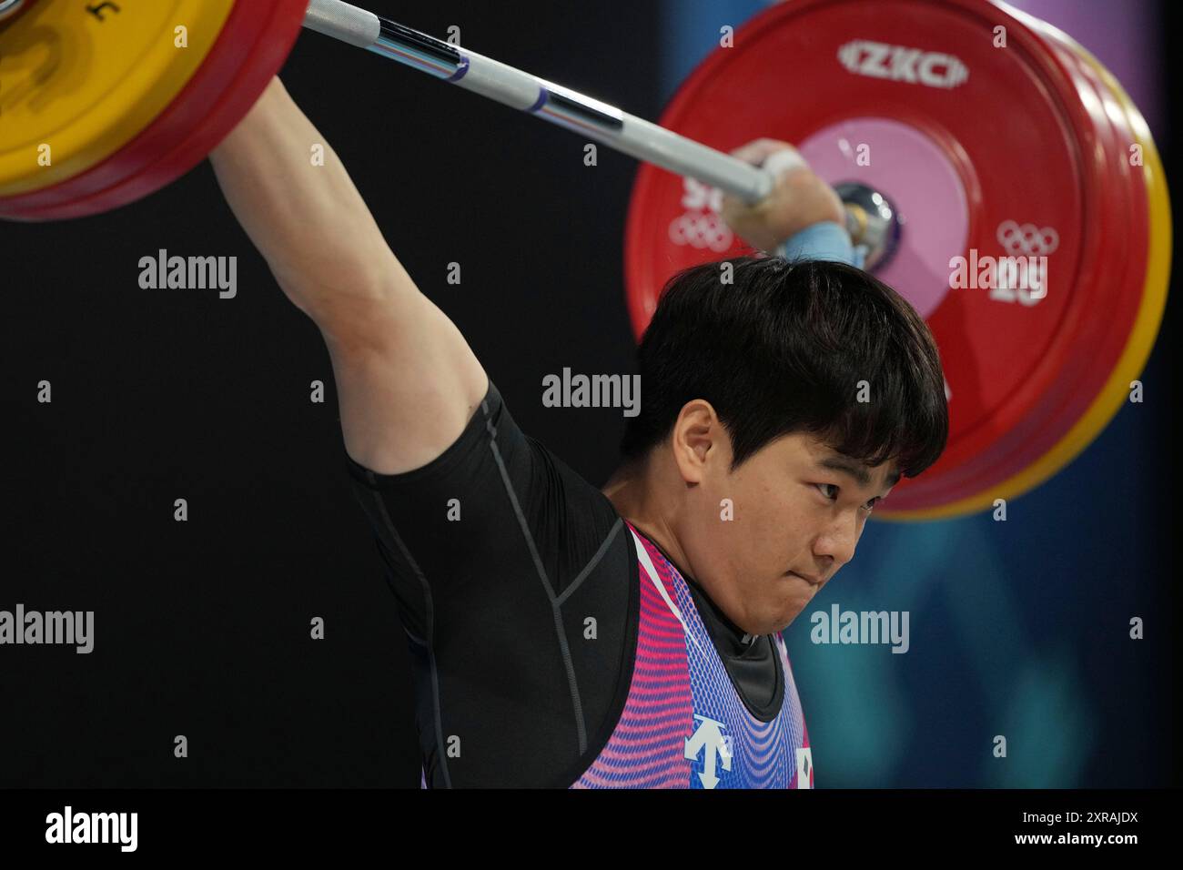 Yu Dong-ju of South Korea competes during the men's 89kg weightlifting ...