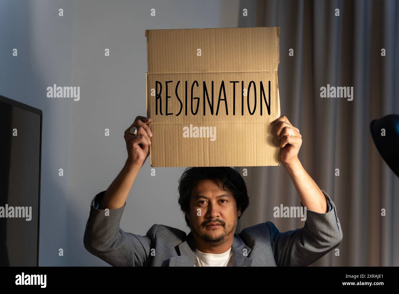 Resignation. businessman holding boxes for personal belongings and ...