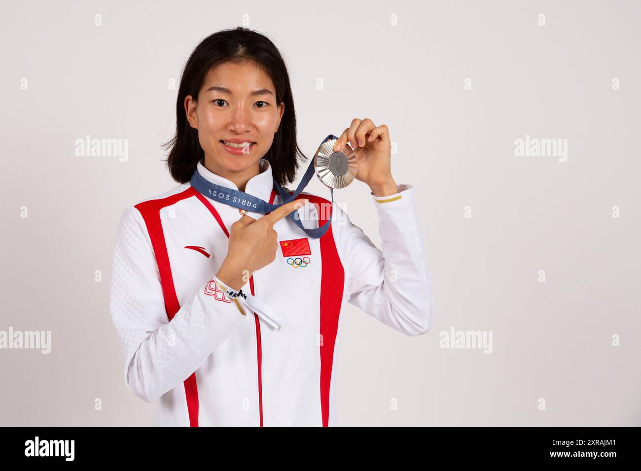 China's women's taekwondo -49kg silver medallist, Guo Qing, poses for a portrait during a photo ...