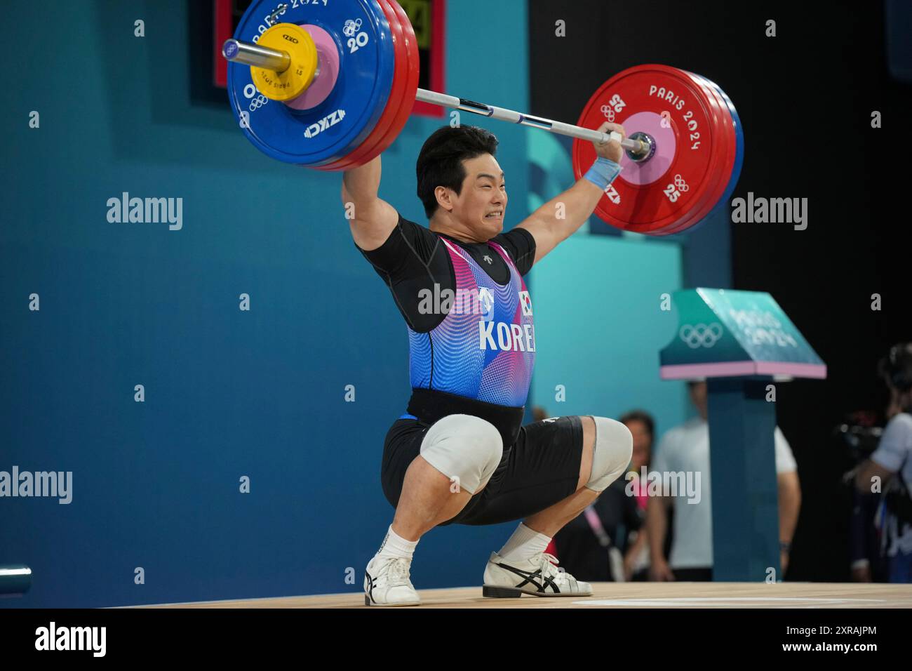 Yu Dong-ju of South Korea competes during the men's 89kg weightlifting ...