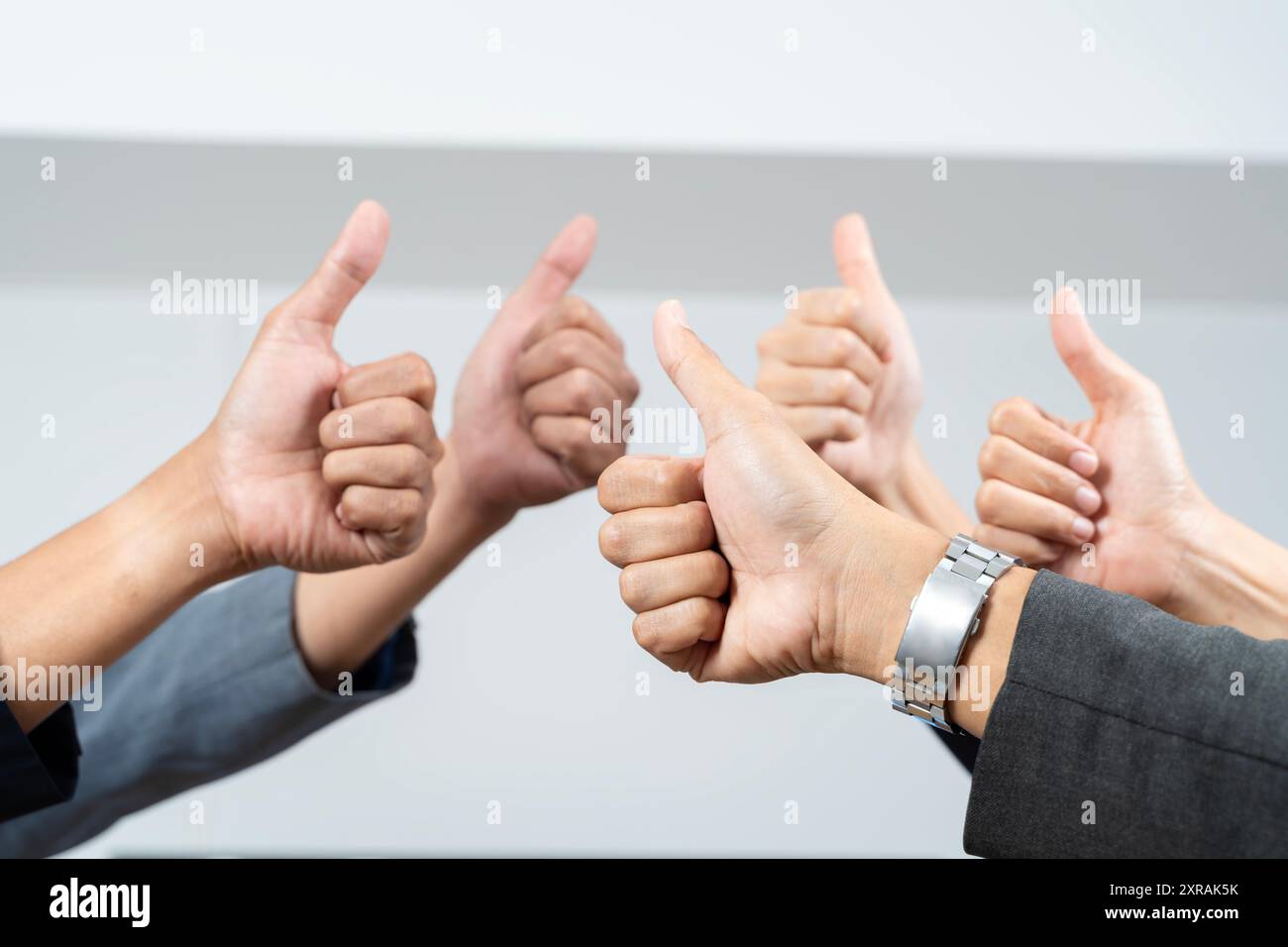 Thumbs up with hands of a business team or group giving their approval ...
