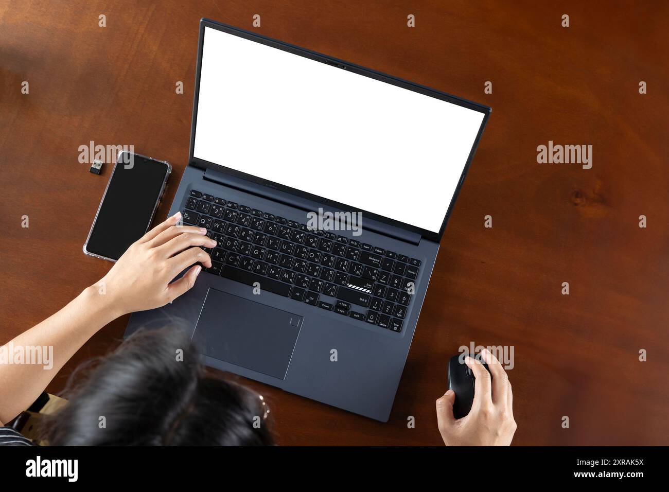 Top view of hand use laptop computer with blank screens on white office ...