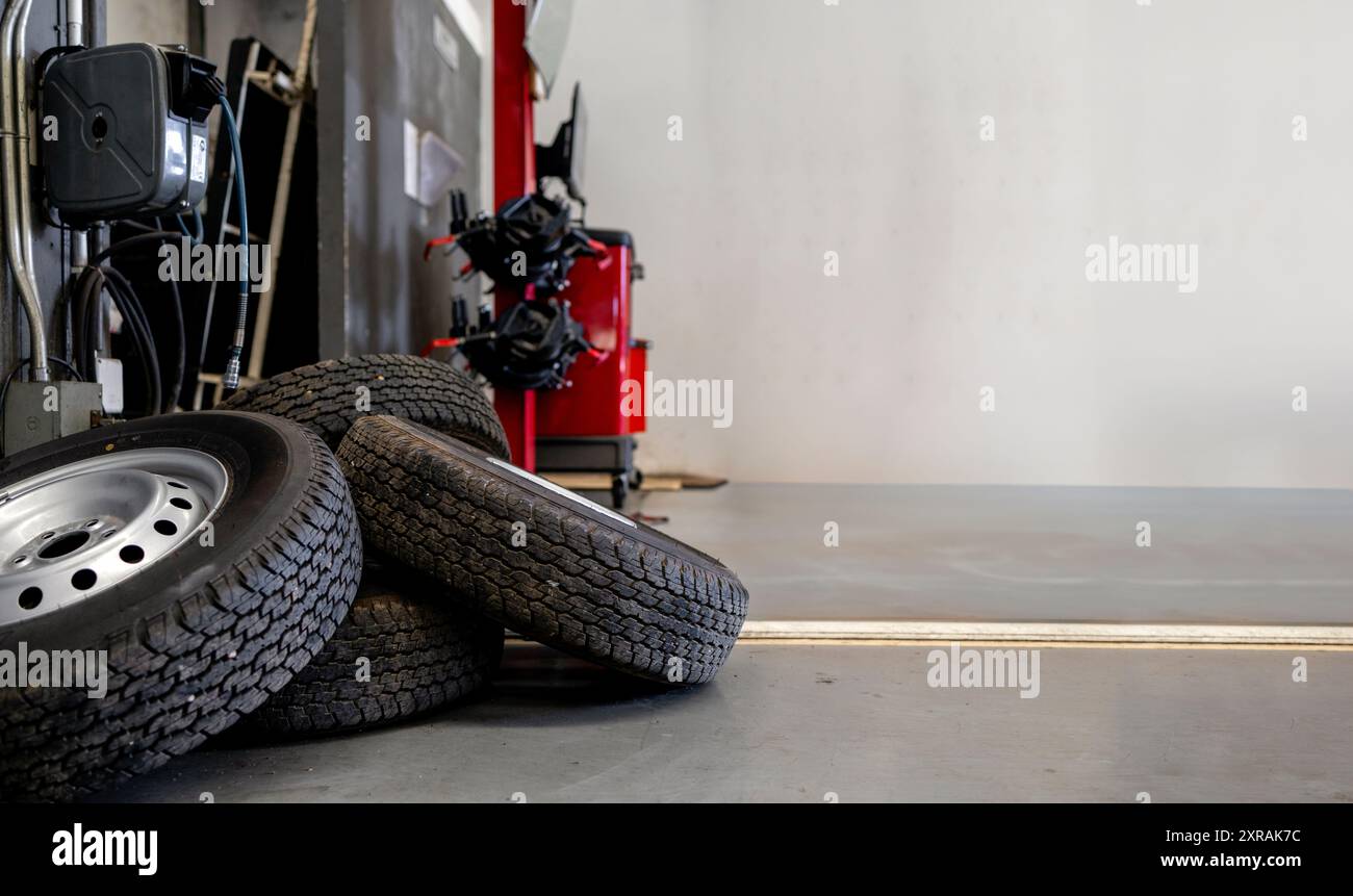 Used Car Tires Stacked in a Garage Stock Photo - Alamy