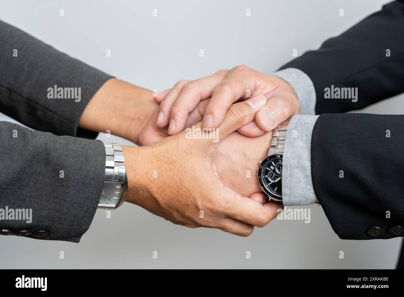 Businessmen shake hands, end of meeting, business concept. Two happy ...