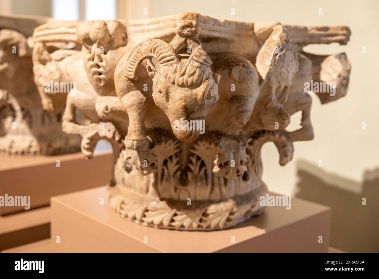 Close-up on sculptures of animals carved in medieval pillar base in ...