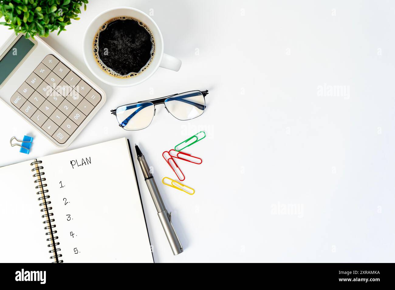 Plan words written in an office notebook. New challenges, new plans ...