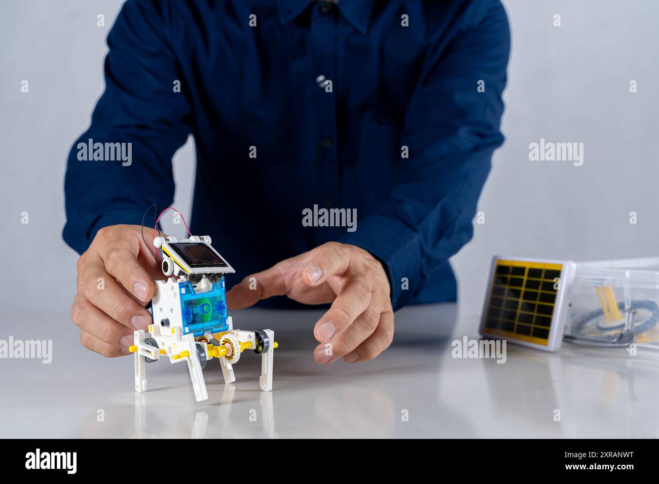 Young man amateurs are using mechanic tools to assemble electric ...