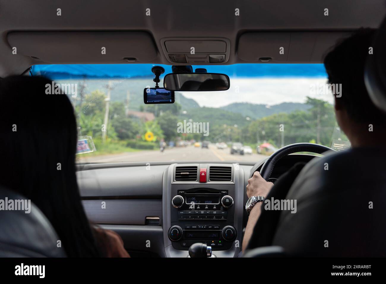 Family and people who will drive Two people sat in the front seat of a ...