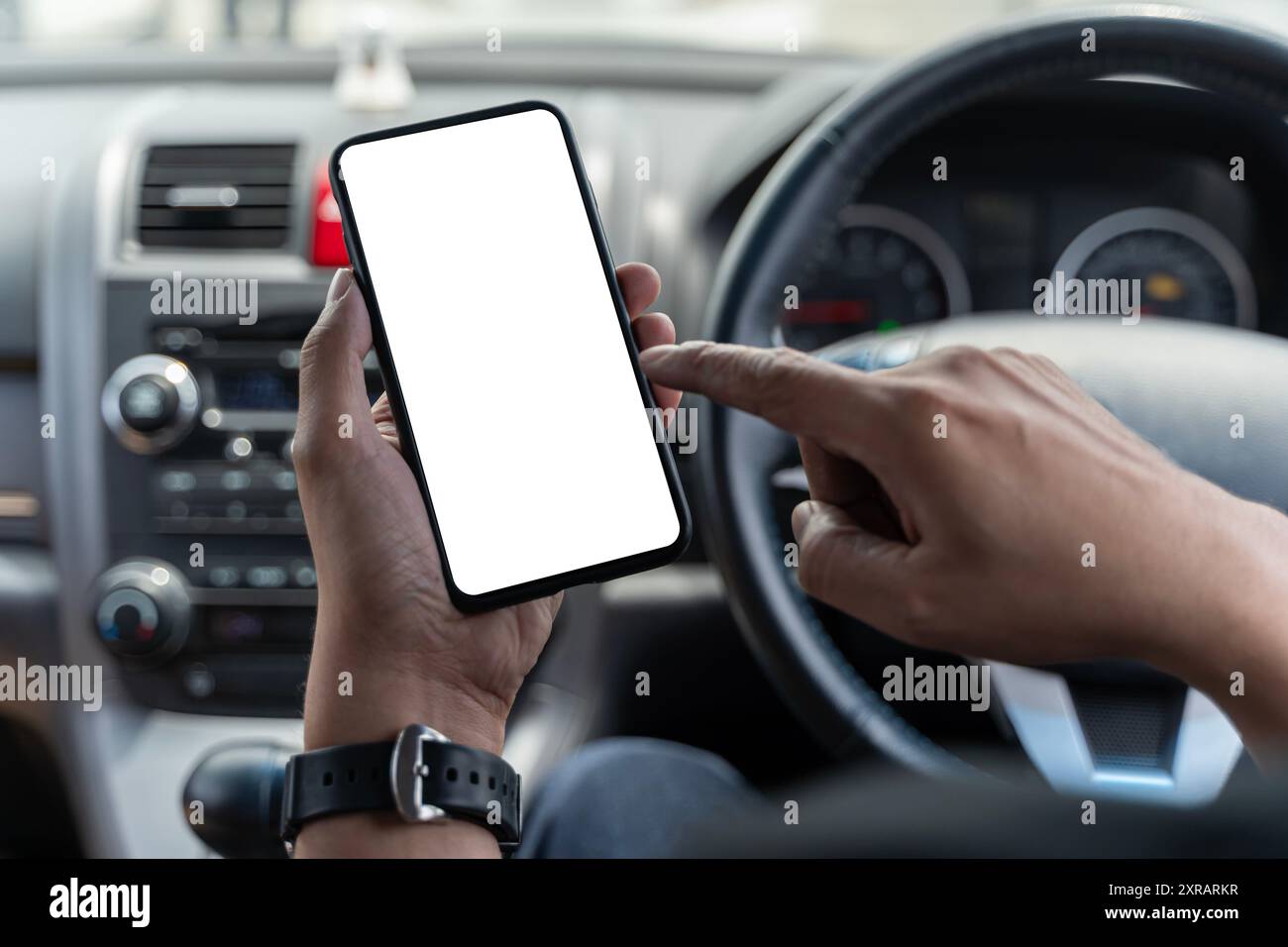 Mockup of man driver hand using blank white screen mobile smart phone ...