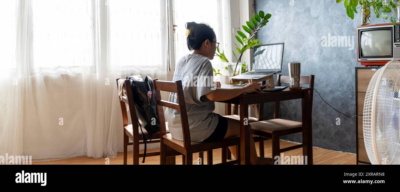 Professional businesswoman working at her home on laptop, young female ...