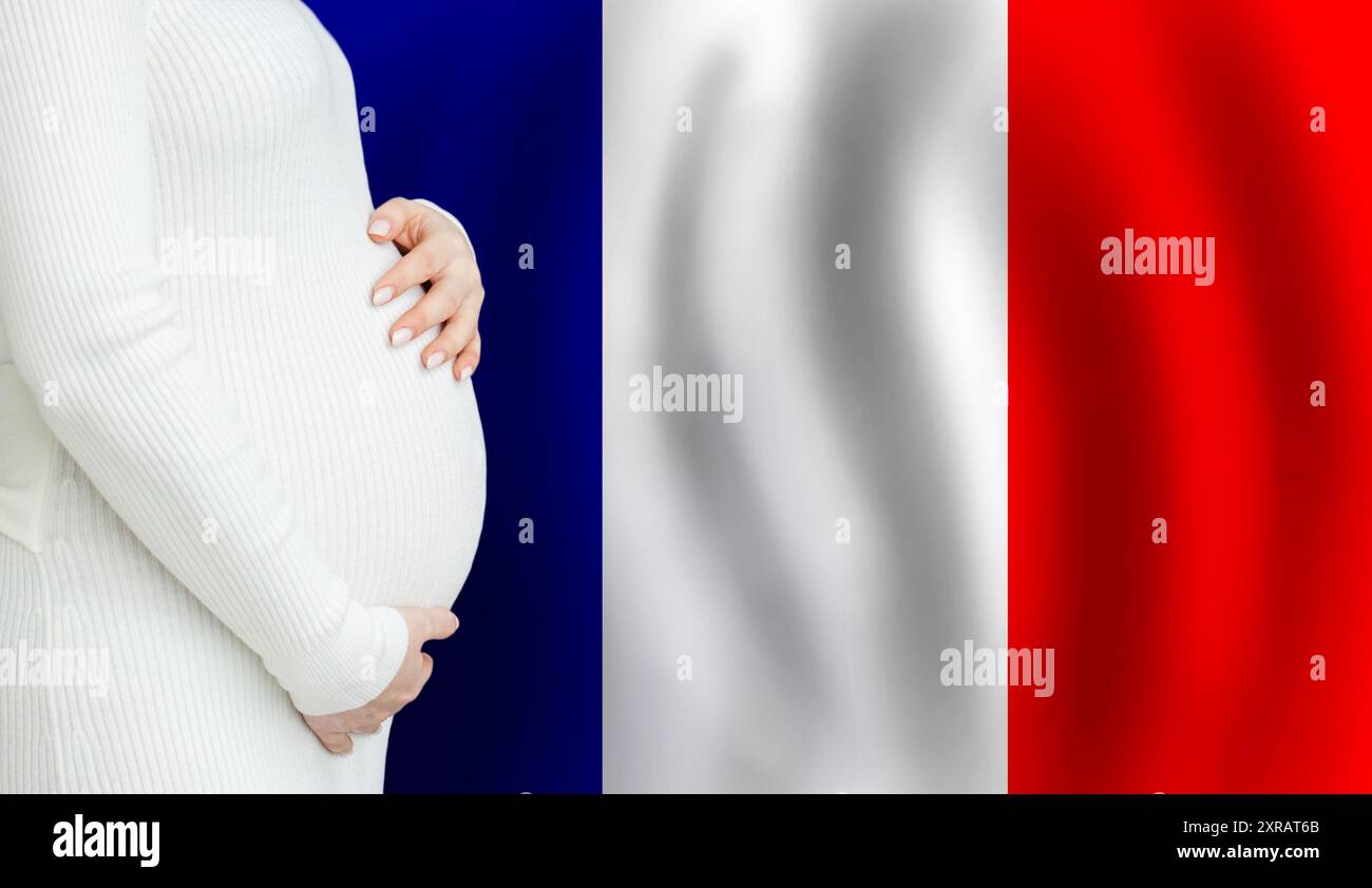 Pregnant woman belly against French flag background. Demographics and ...