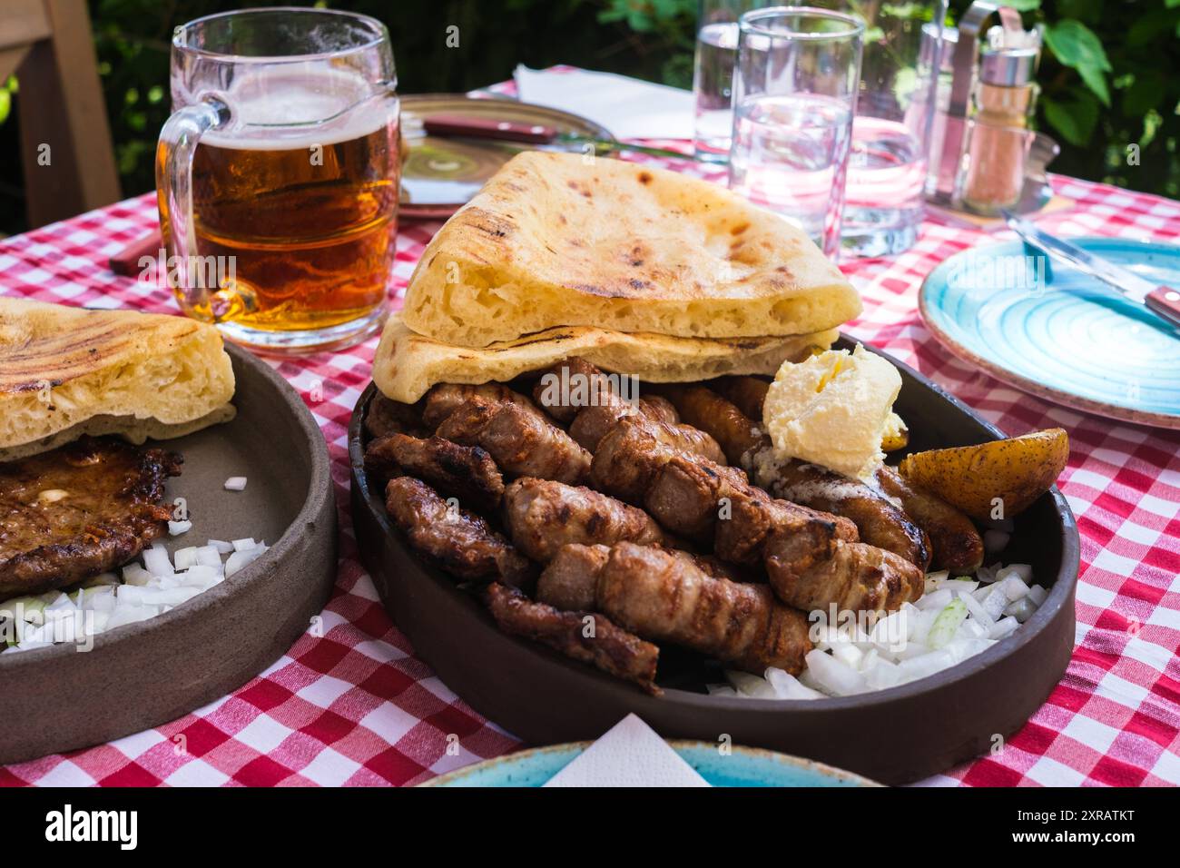 Typical Croatian food, grilled meat and beer Stock Photo - Alamy